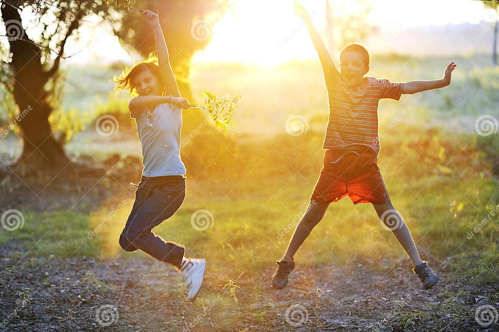 Children Play Against the Sun Stock Photo - Image of park, dark: 21098824