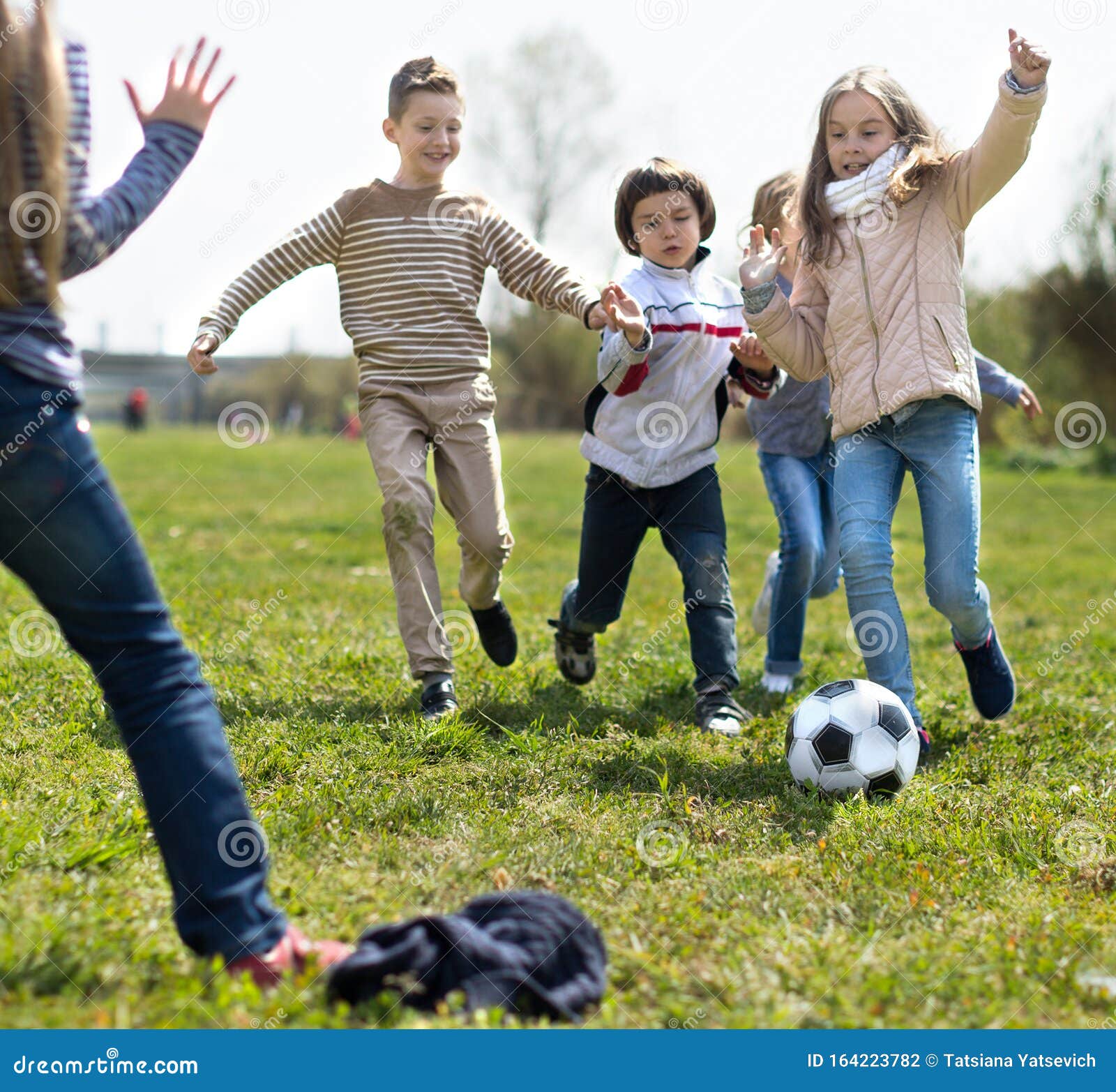 Children Play with Ball Outdoors in Spring Stock Photo - Image of ...