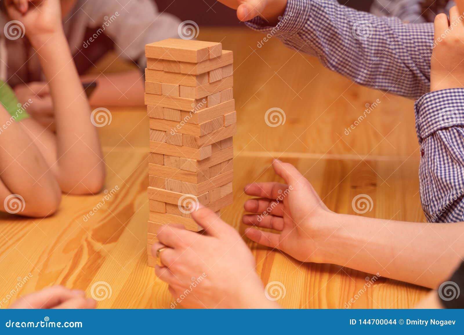Children Play a Board Game, a Wooden Tower Stock Photo - Image of build ...