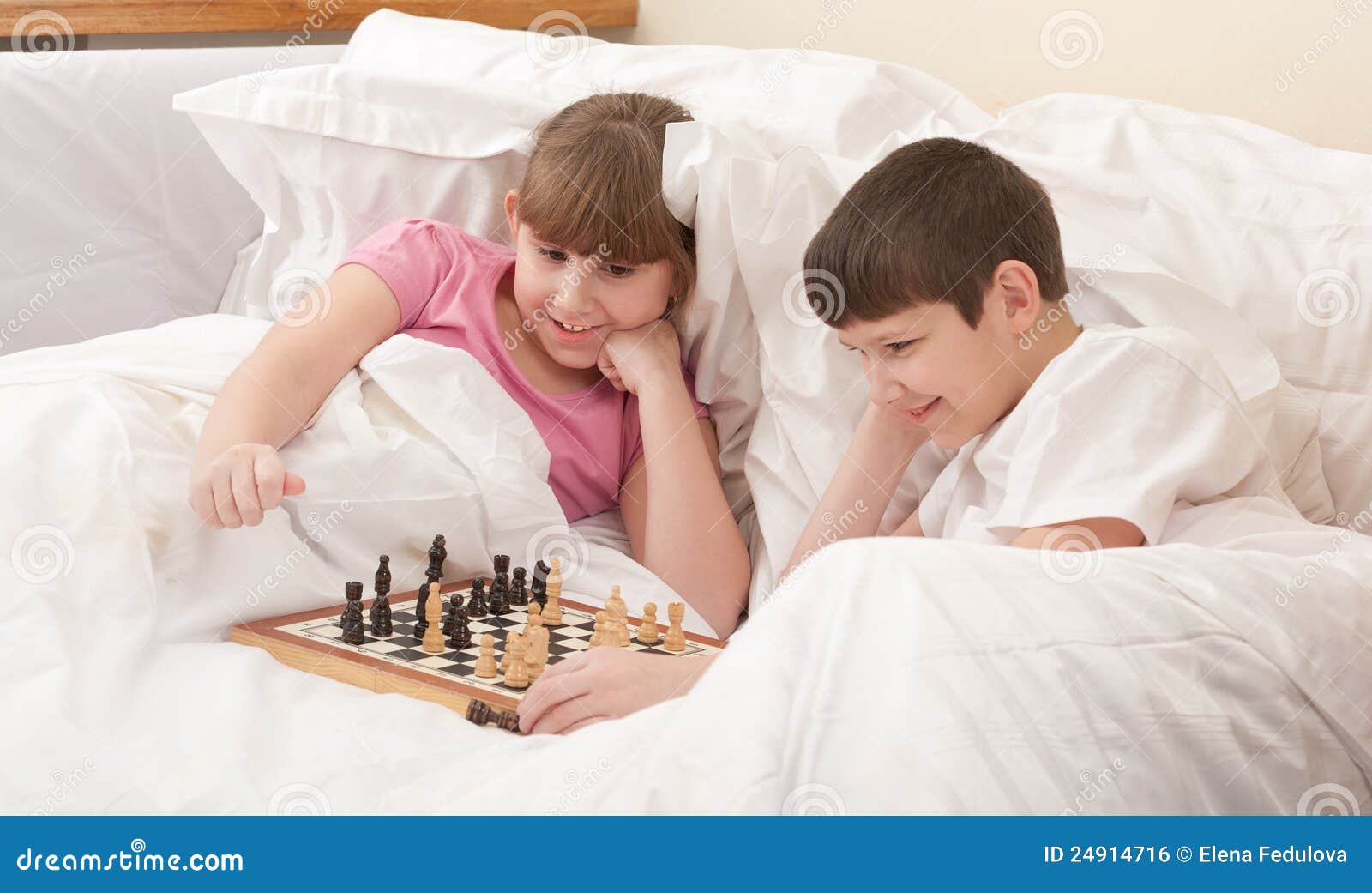 Children Play Chess in a Bed Stock Photo - Image of logic, infant: 24914716