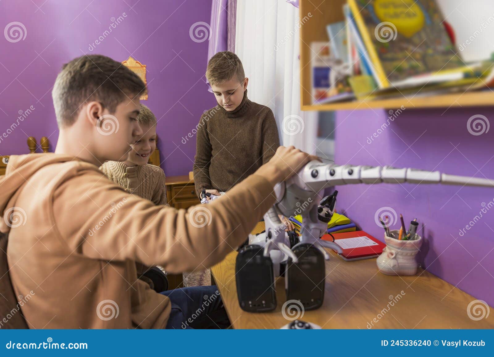 Kids playing with robots stock photo. Image of child - 245336240