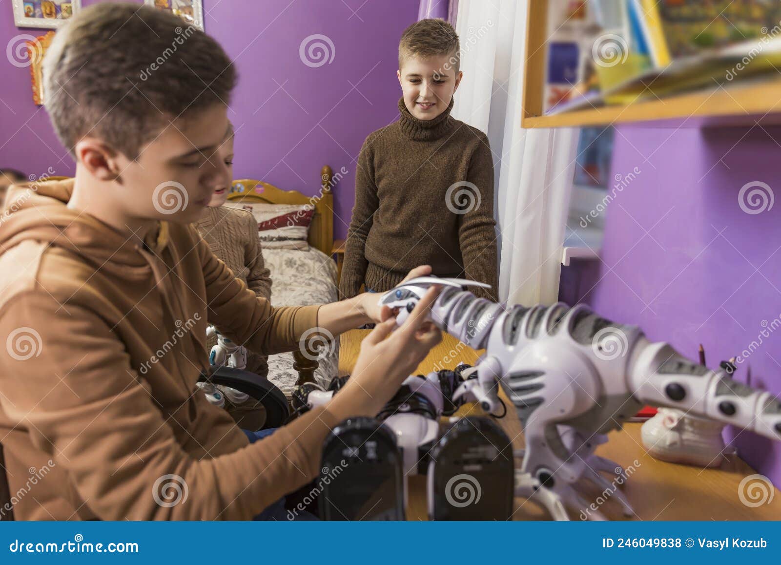 Kids playing with robots stock photo. Image of technology - 246049838