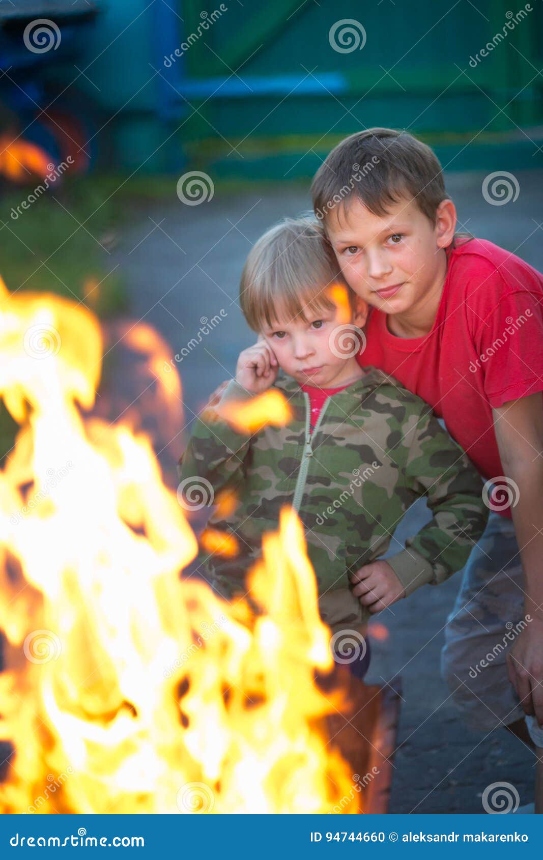 Children Play with Fire in the Grill Stock Photo - Image of outdoors ...