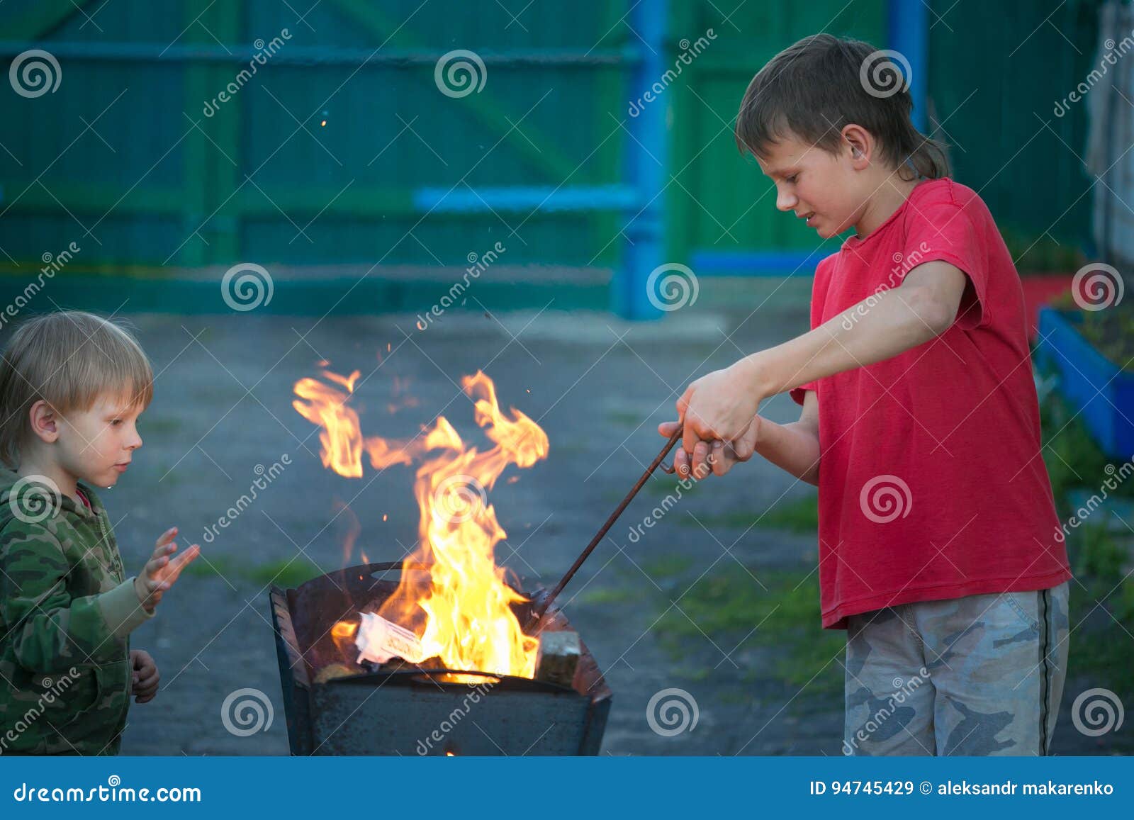 Children Play with Fire in the Grill Stock Image - Image of family ...