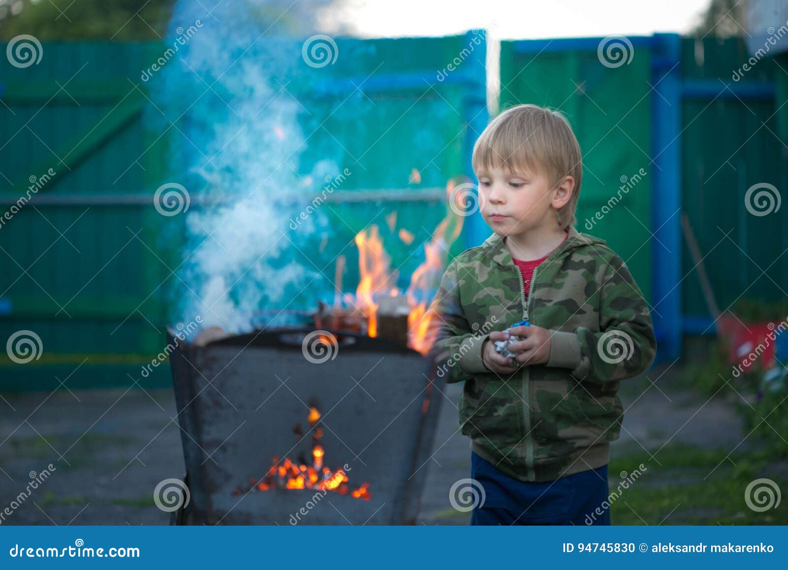 Children Play with Fire in the Grill Stock Photo - Image of female ...
