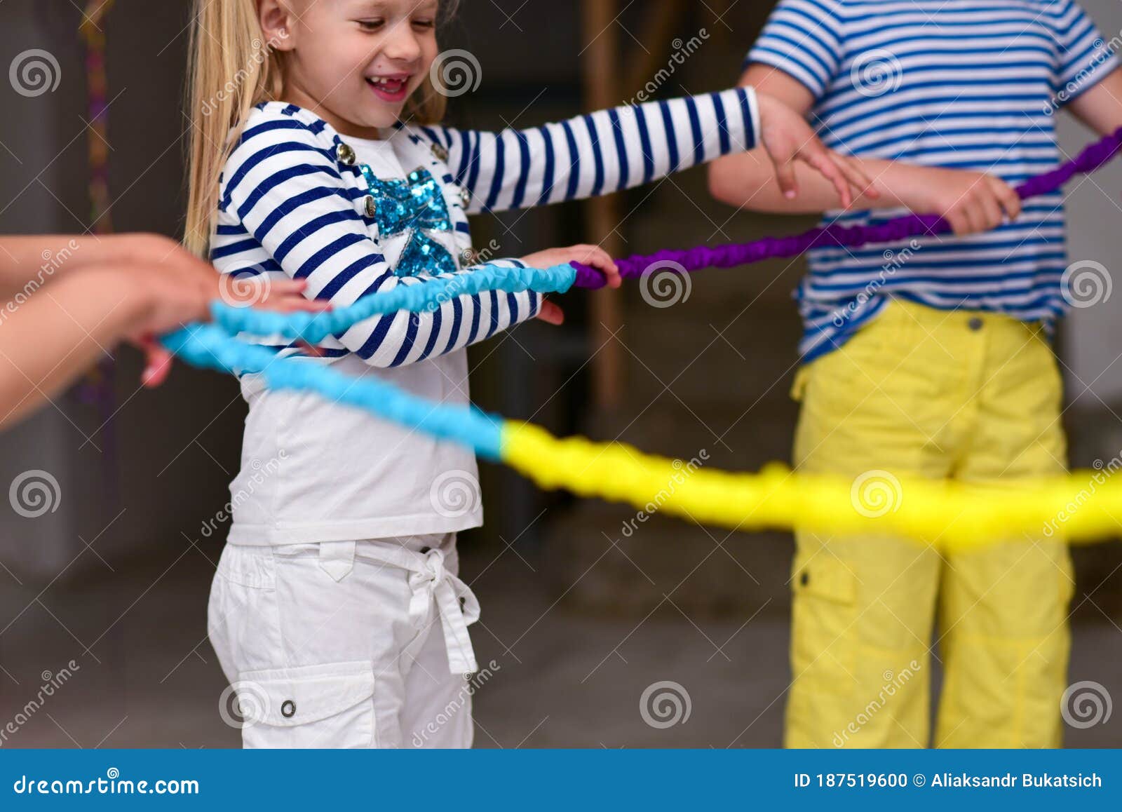 Children Play a Game Pull the Ribbon at the Party Stock Photo - Image ...