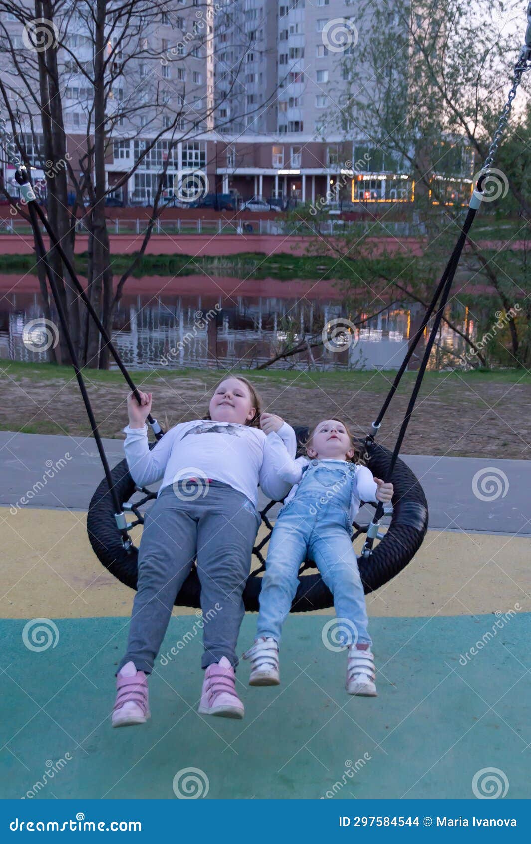 Children Play on a Modern, Secure Playground Stock Photo - Image of ...