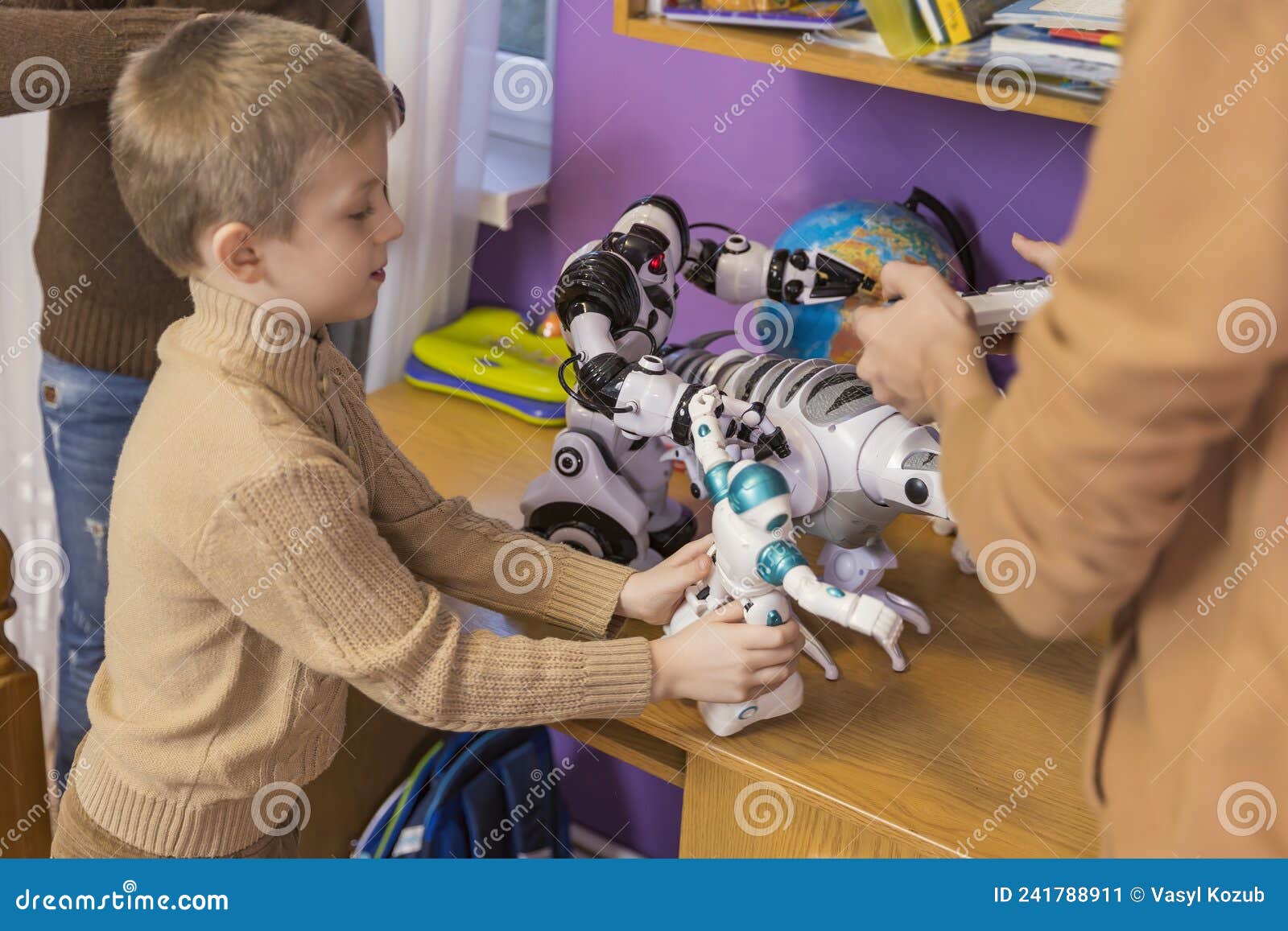 Kids playing with robots stock image. Image of happy - 241788911
