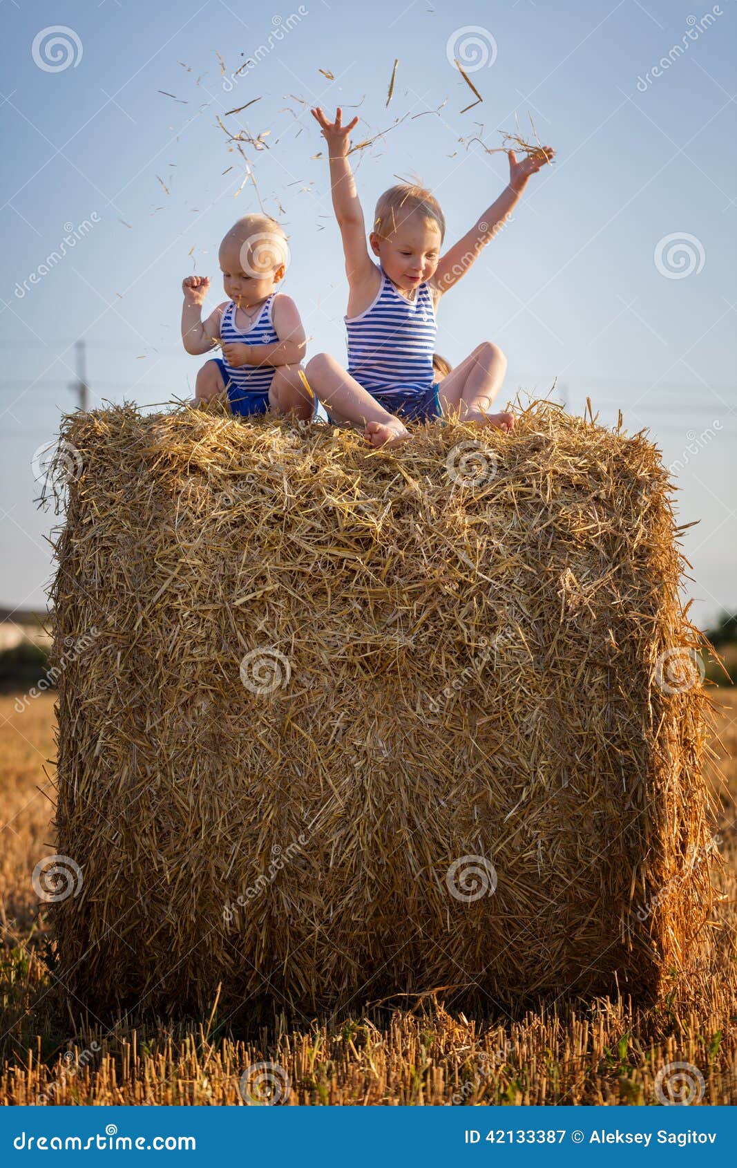 Children Play Sitting on a Haystack Stock Image - Image of play, hands ...