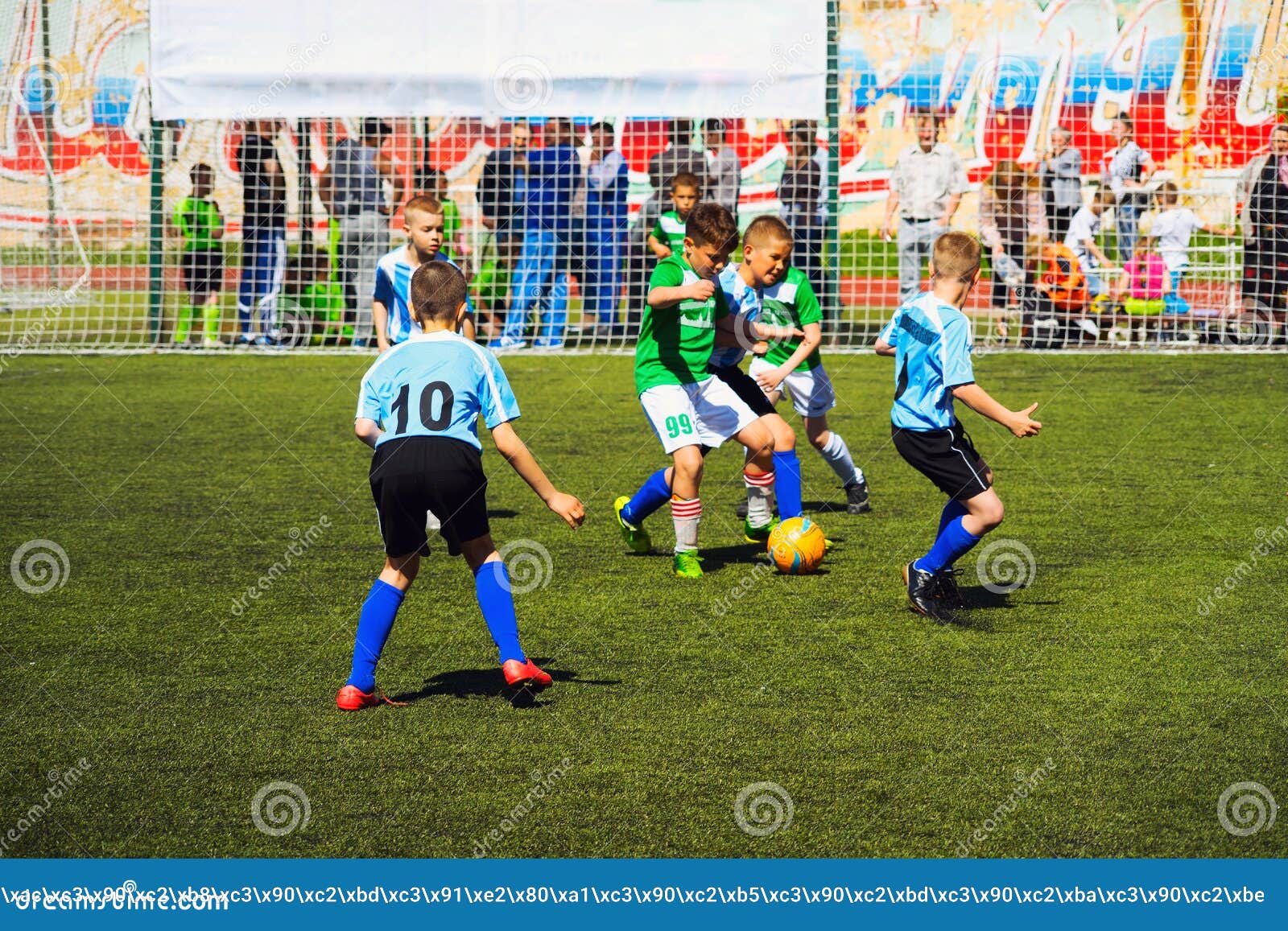 Children Play Soccer on Field with Artificial Turf. Editorial ...