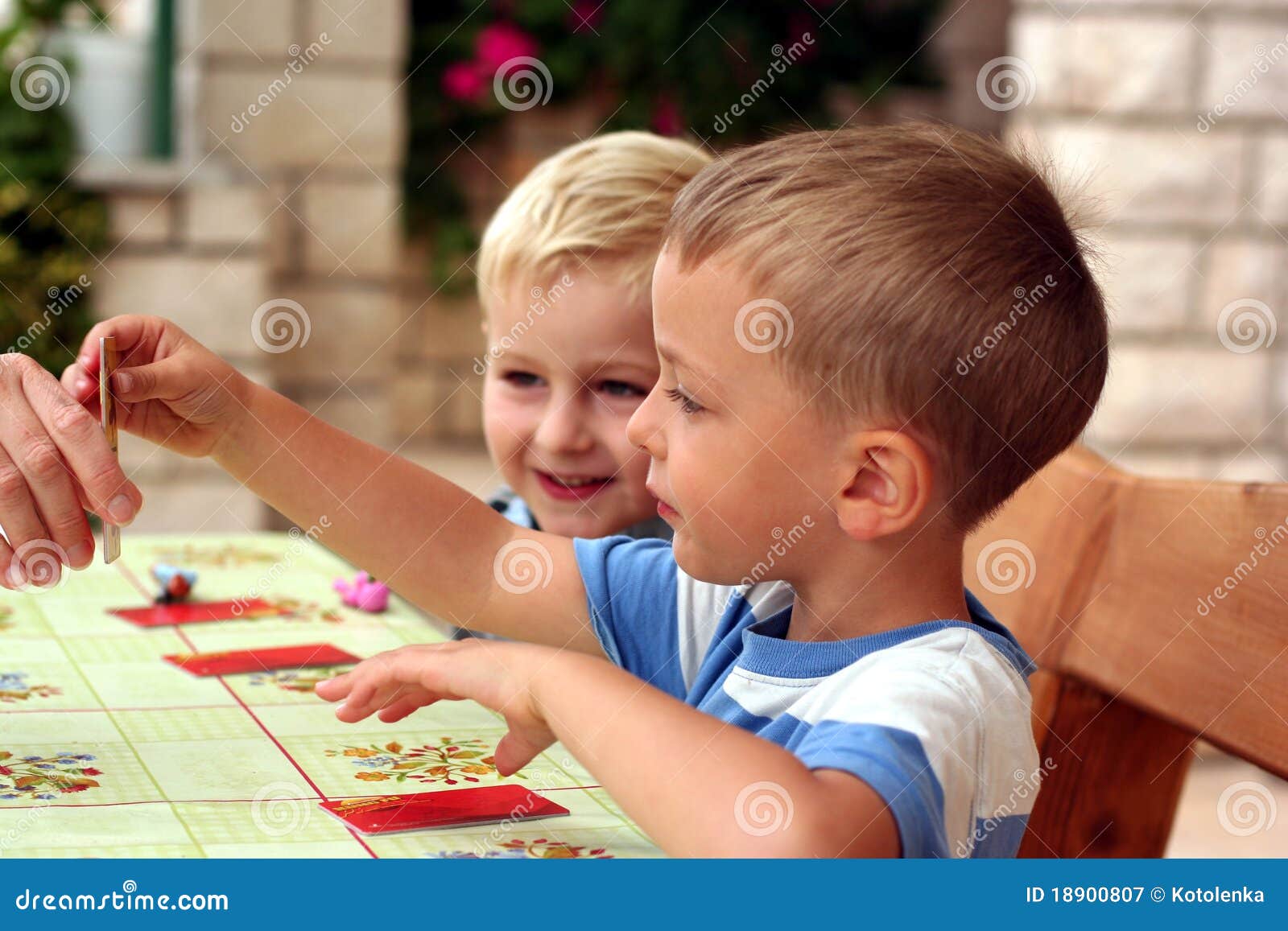 Children play a table game stock image. Image of event - 18900807
