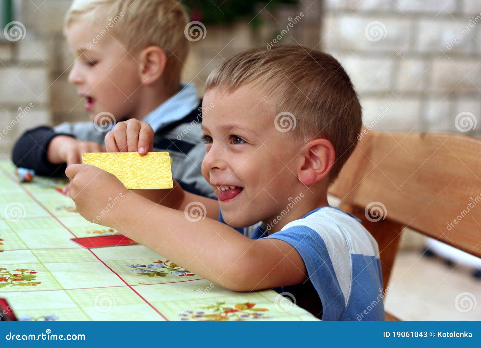 Children play a table game stock image. Image of activity - 19061043