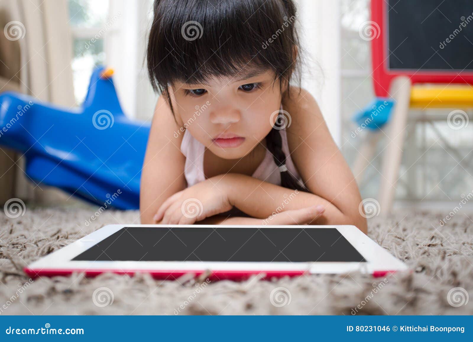 Children Play Tablet on Living Room Carpet Stock Photo - Image of ...