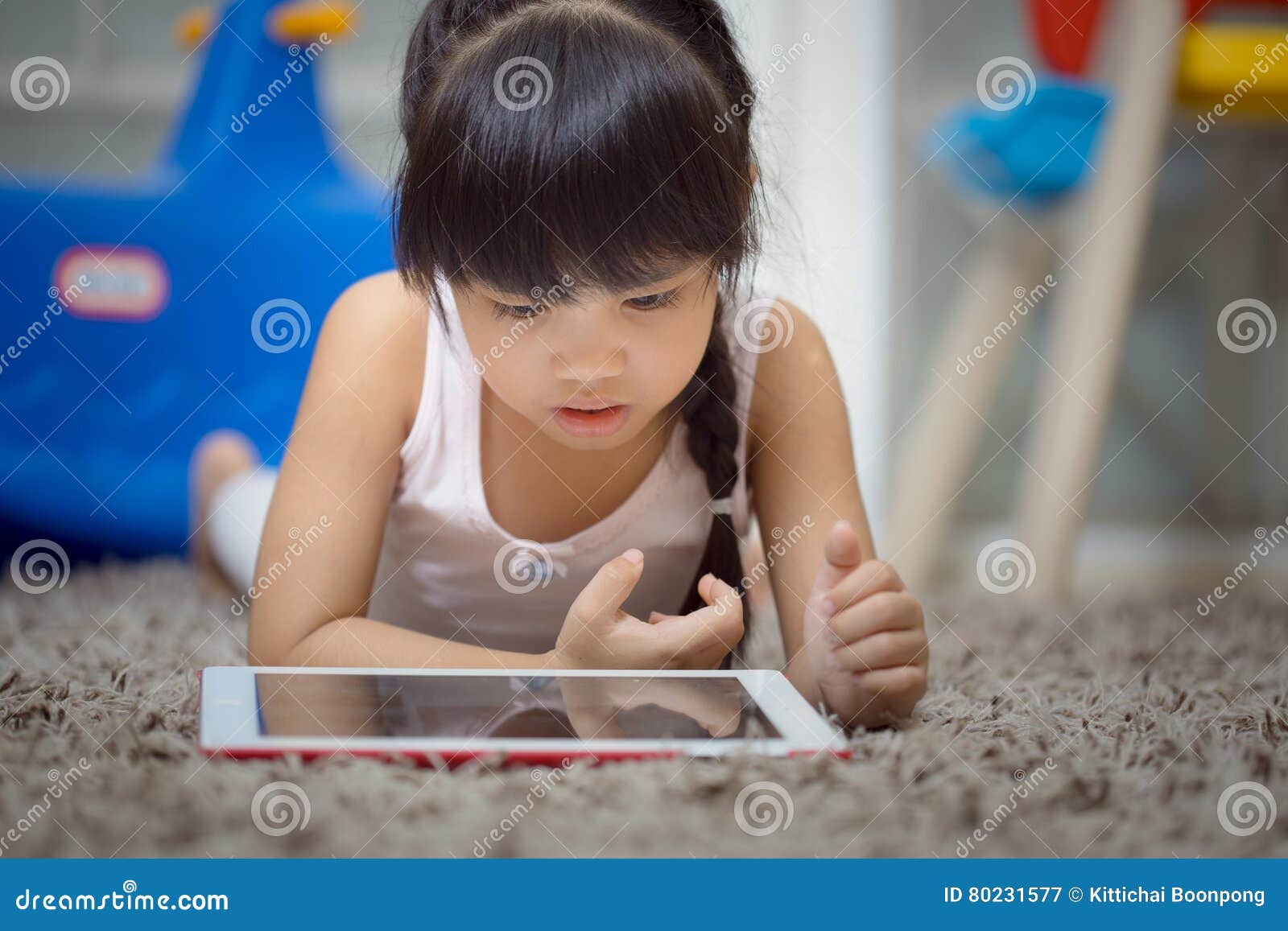 Children Play Tablet on Living Room Carpet Stock Image - Image of ...