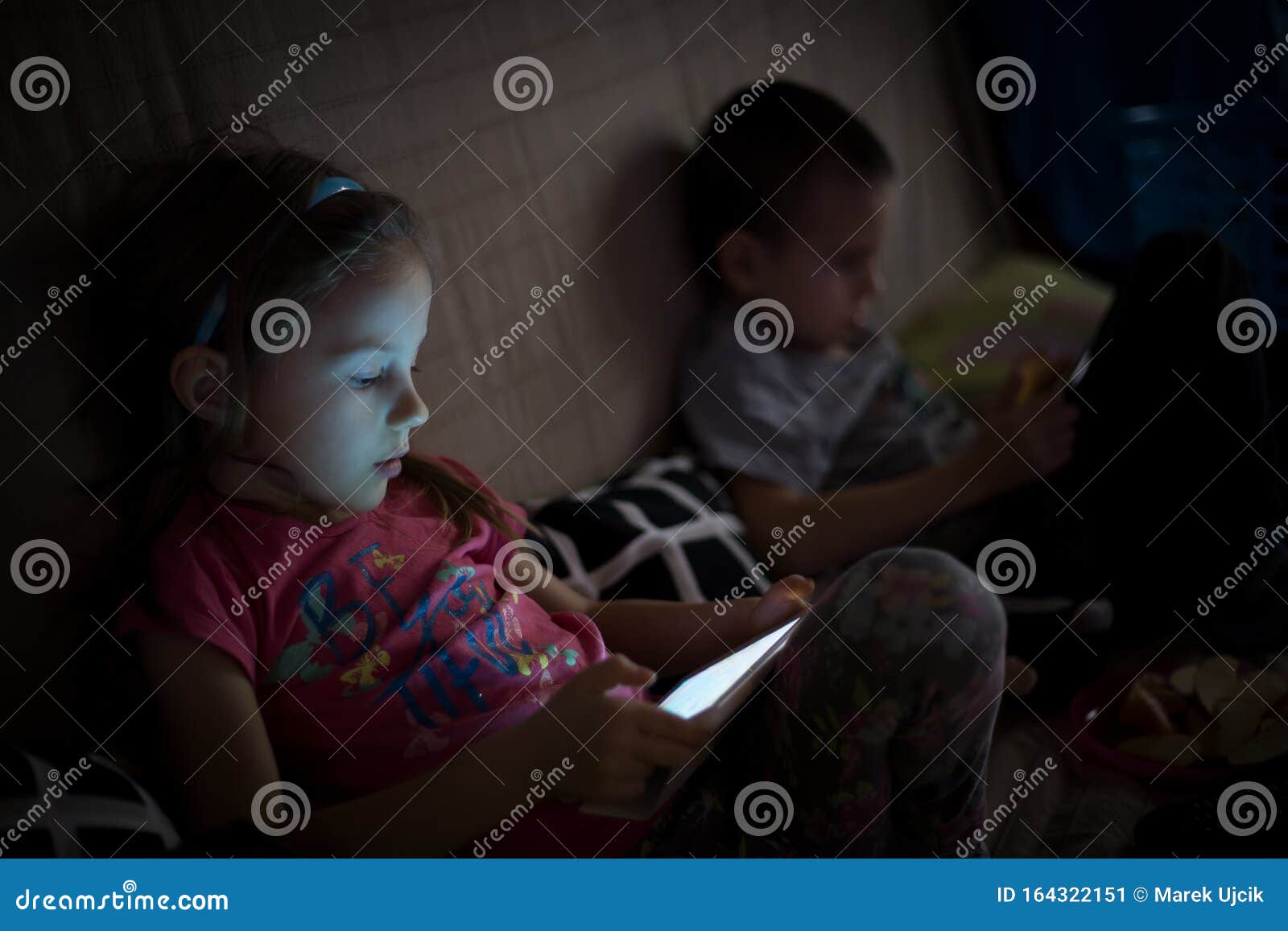 Children Play on the Tablets in the Dim Light Stock Image - Image of ...