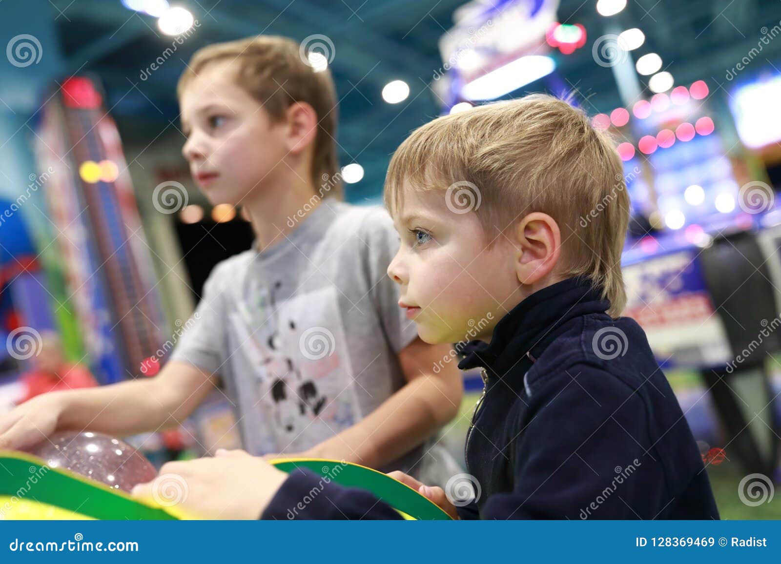 Children Playing Arcade Game Stock Image - Image of cheerful, activity ...