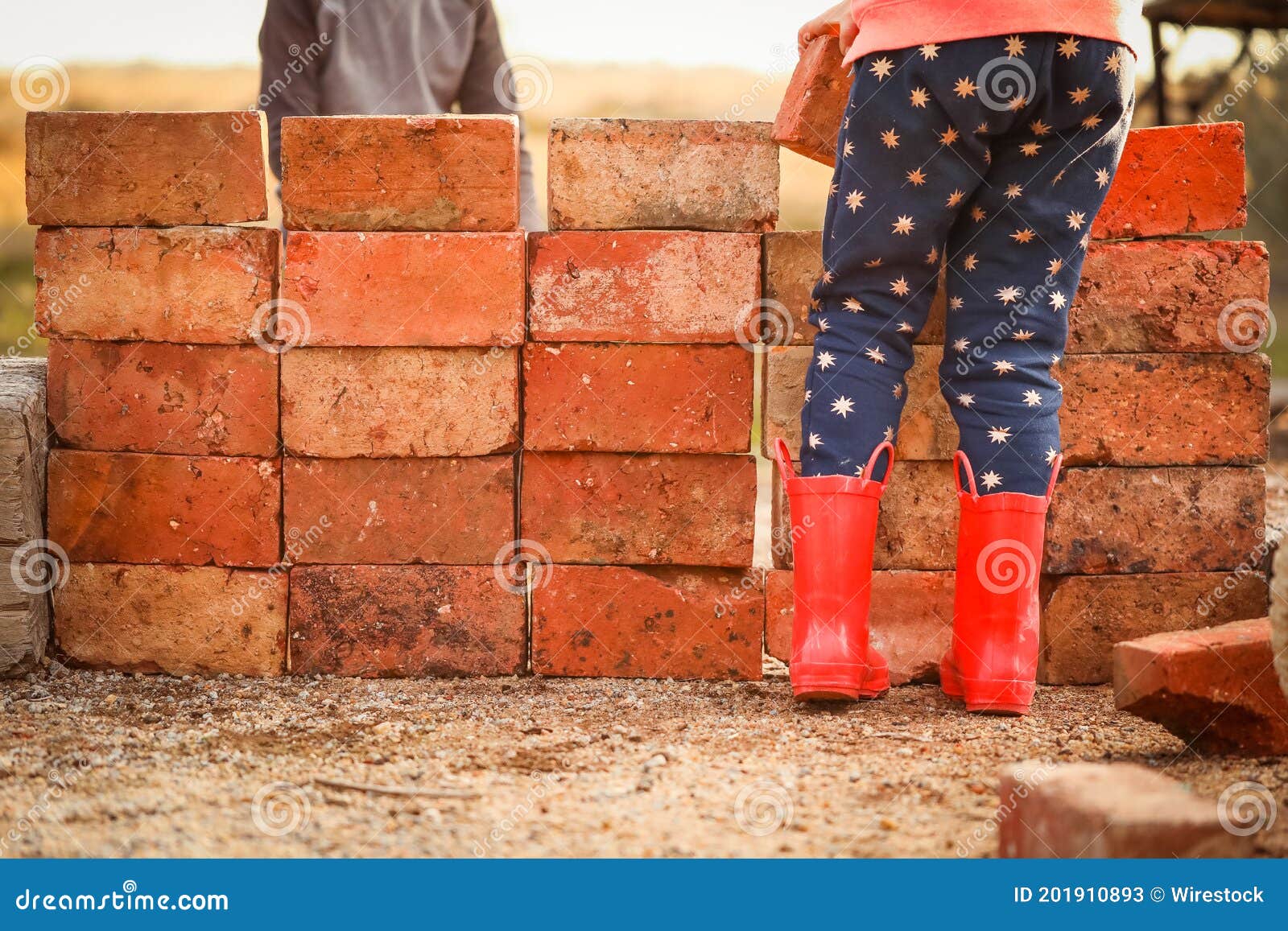 Children Playing in Backyard Building a Brick Wall Stock Image - Image ...