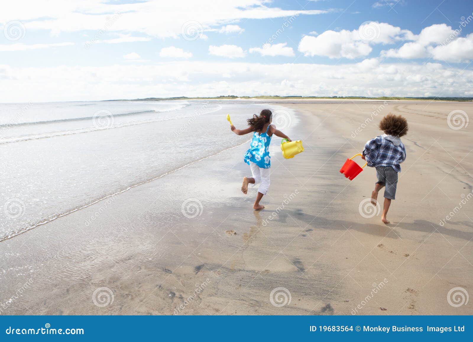 Children playing on beach stock photo. Image of bucket - 19683564