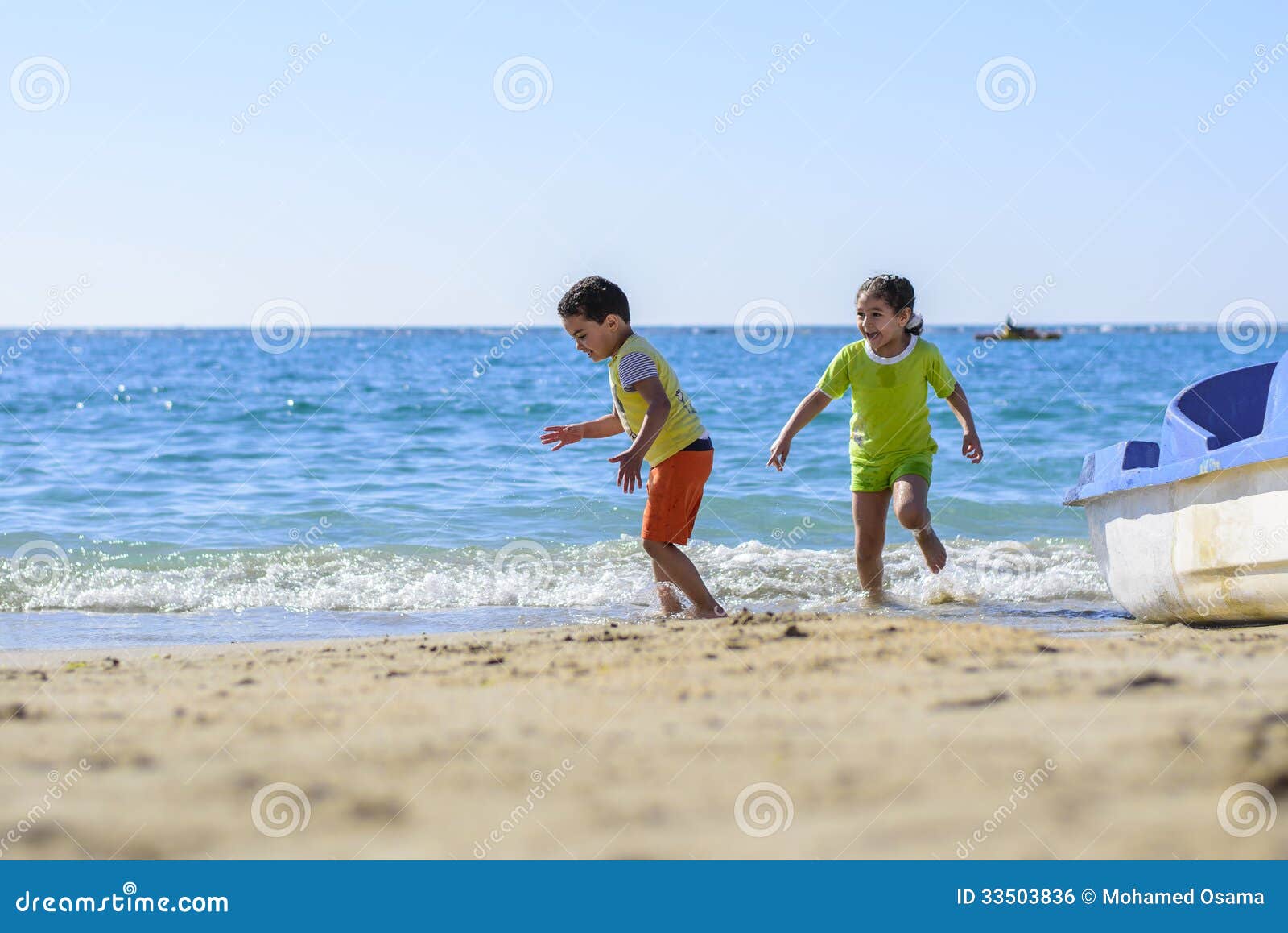 Children Playing at Beach stock photo. Image of picnic - 33503836