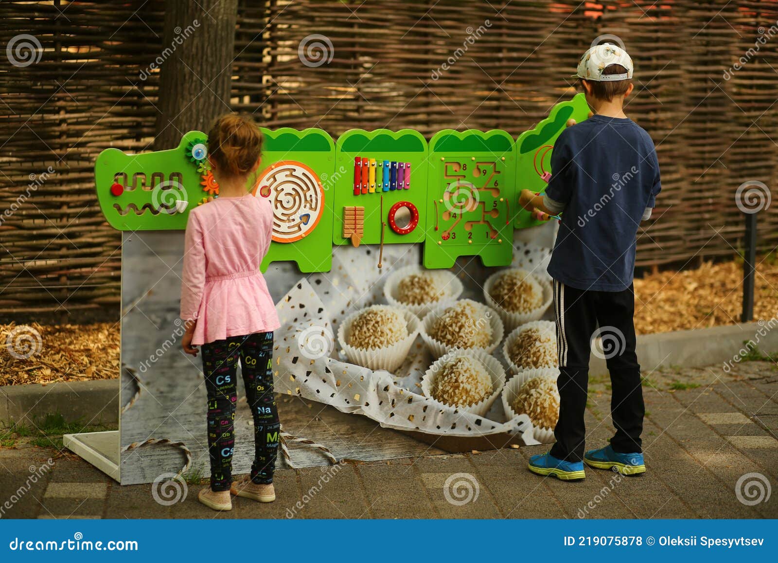 Children Playing with a Busyboard in the Nursery Stock Photo - Image of ...
