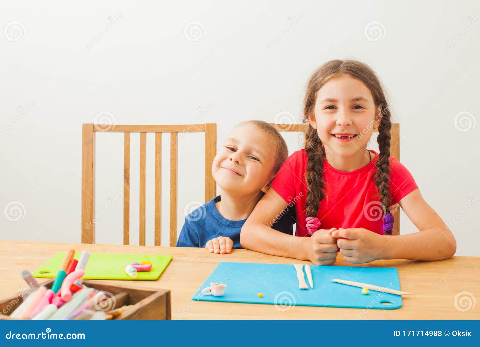 Children Playing with Colorful Clay at the Table Stock Photo - Image of ...