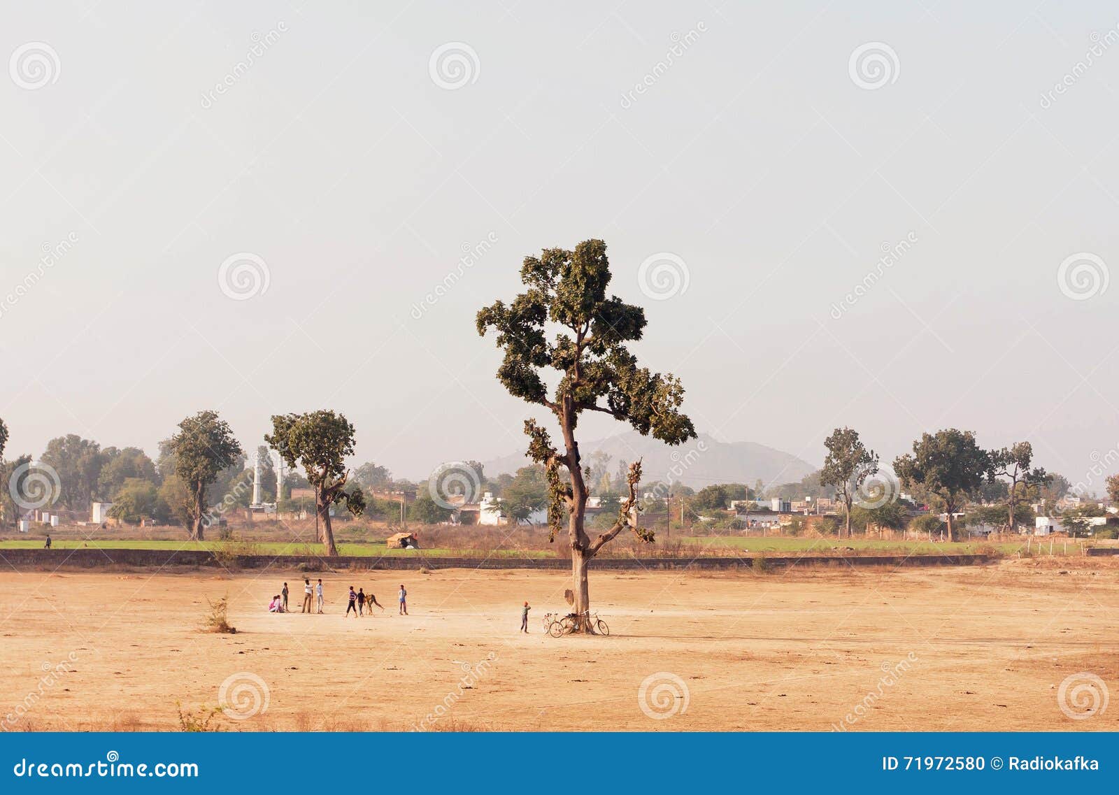 Children Playing in the Field of Cricket. Landscape in India Stock ...