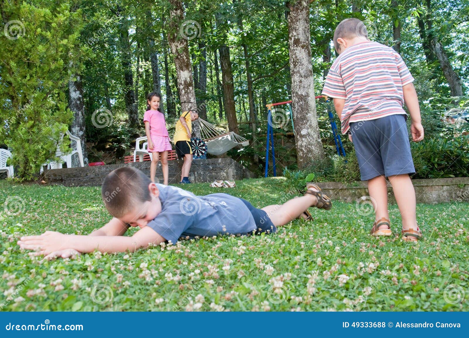 Children Playing in a Field Stock Photo - Image of happy, summer: 49333688