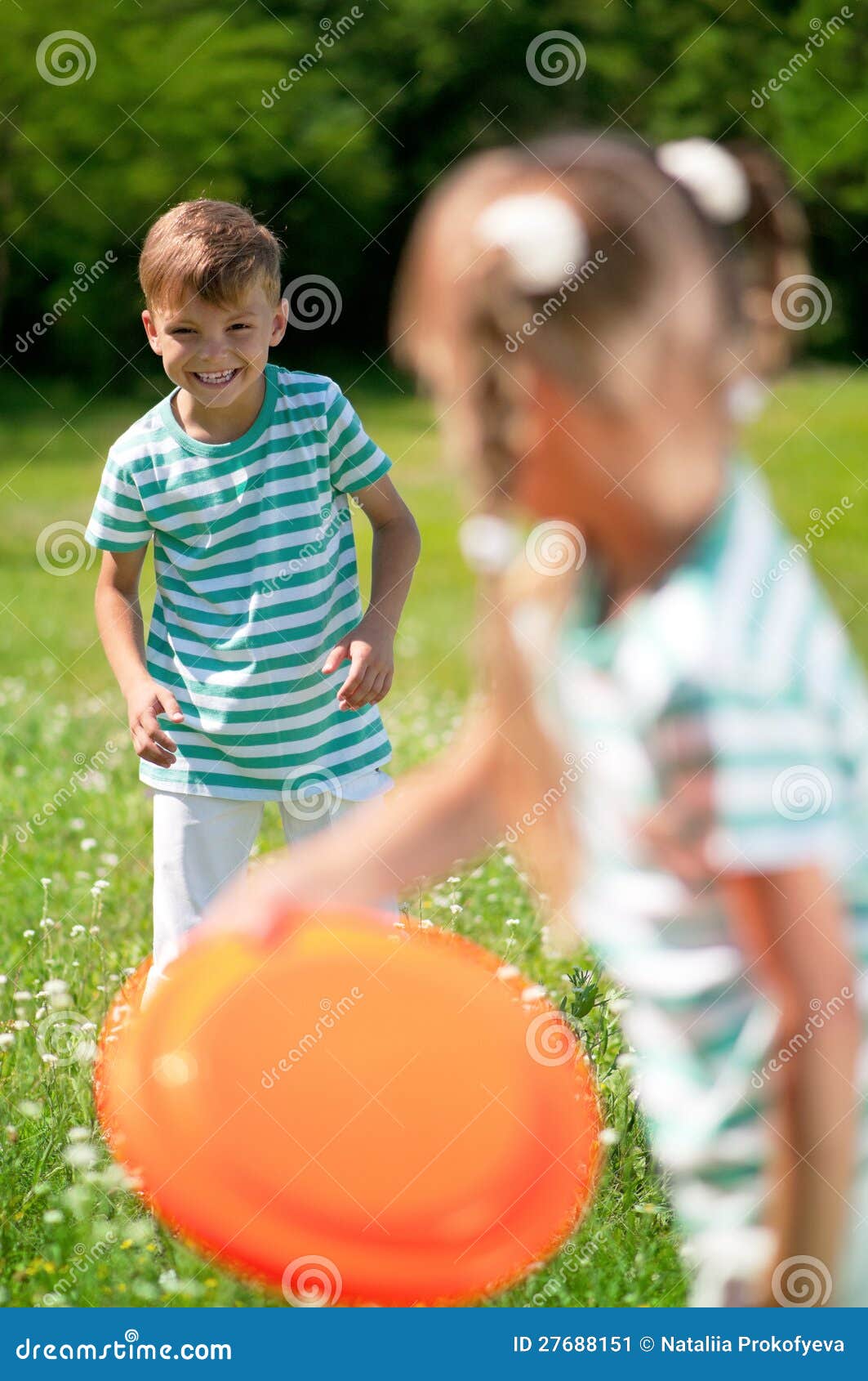 Children playing frisbee stock image. Image of energy - 27688151