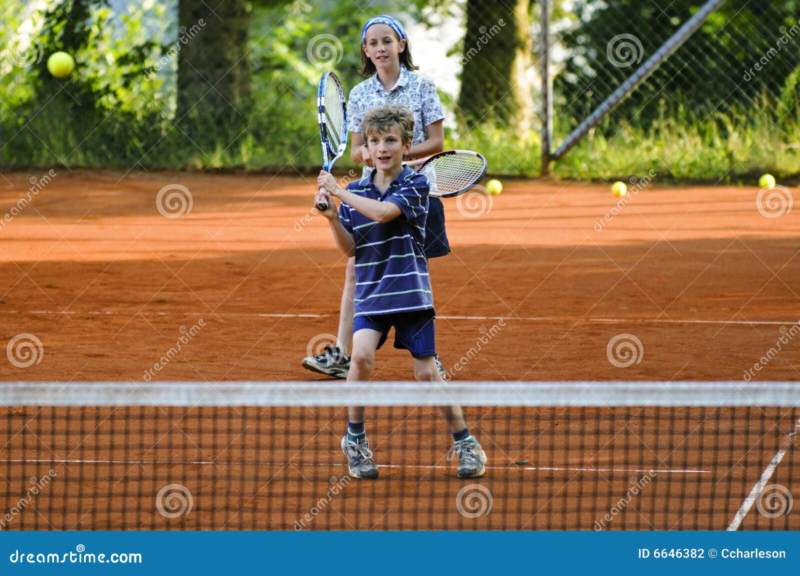 Children Playing Game of Tennis Stock Photo - Image of compete ...