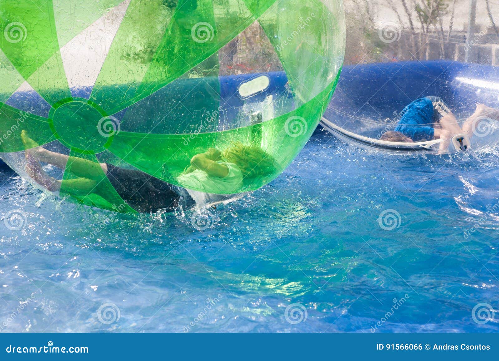 Children Playing in an Inflatable Plastic Balloon on the Water Stock ...