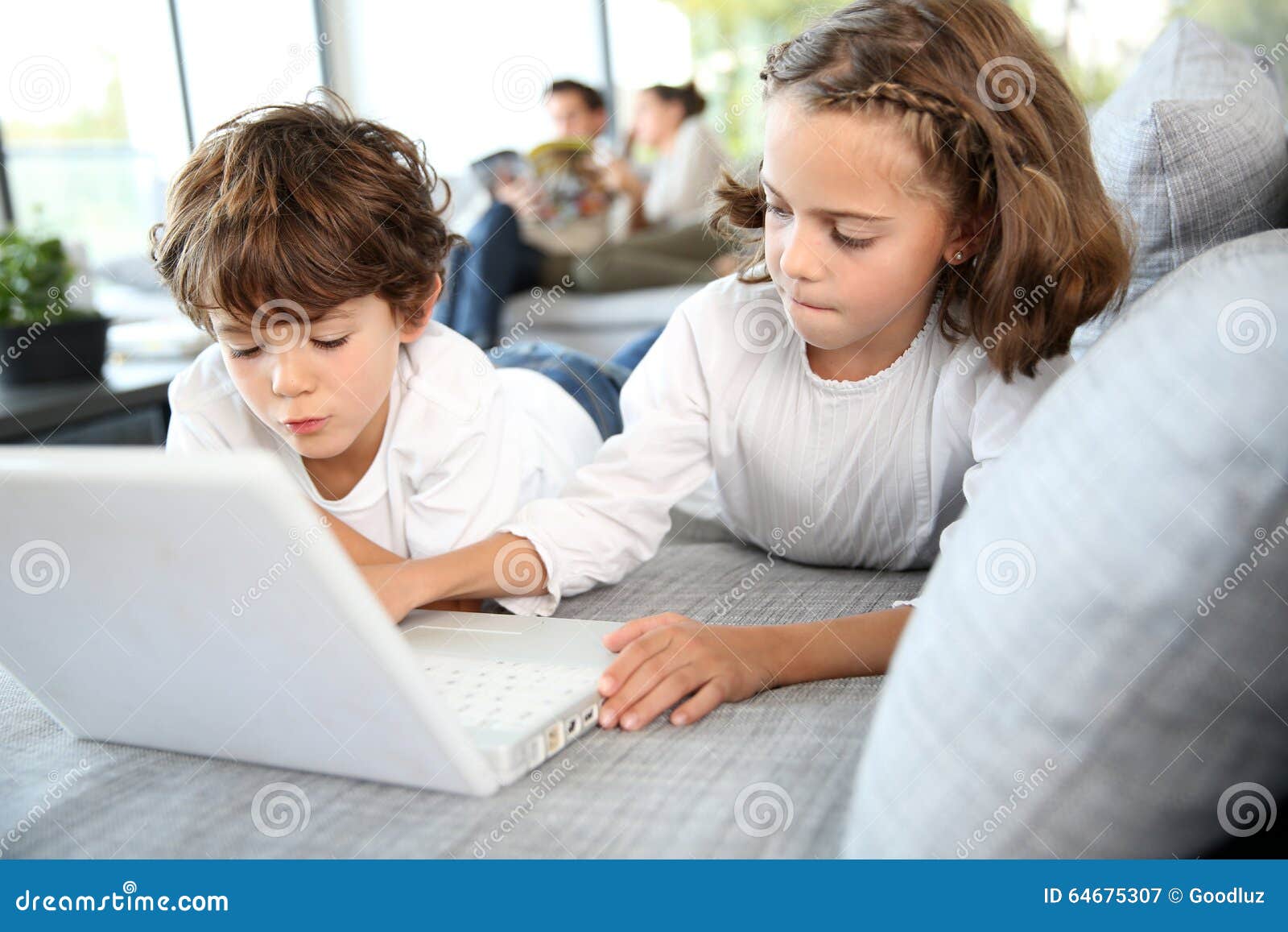 Children playing on laptop stock image. Image of house - 64675307