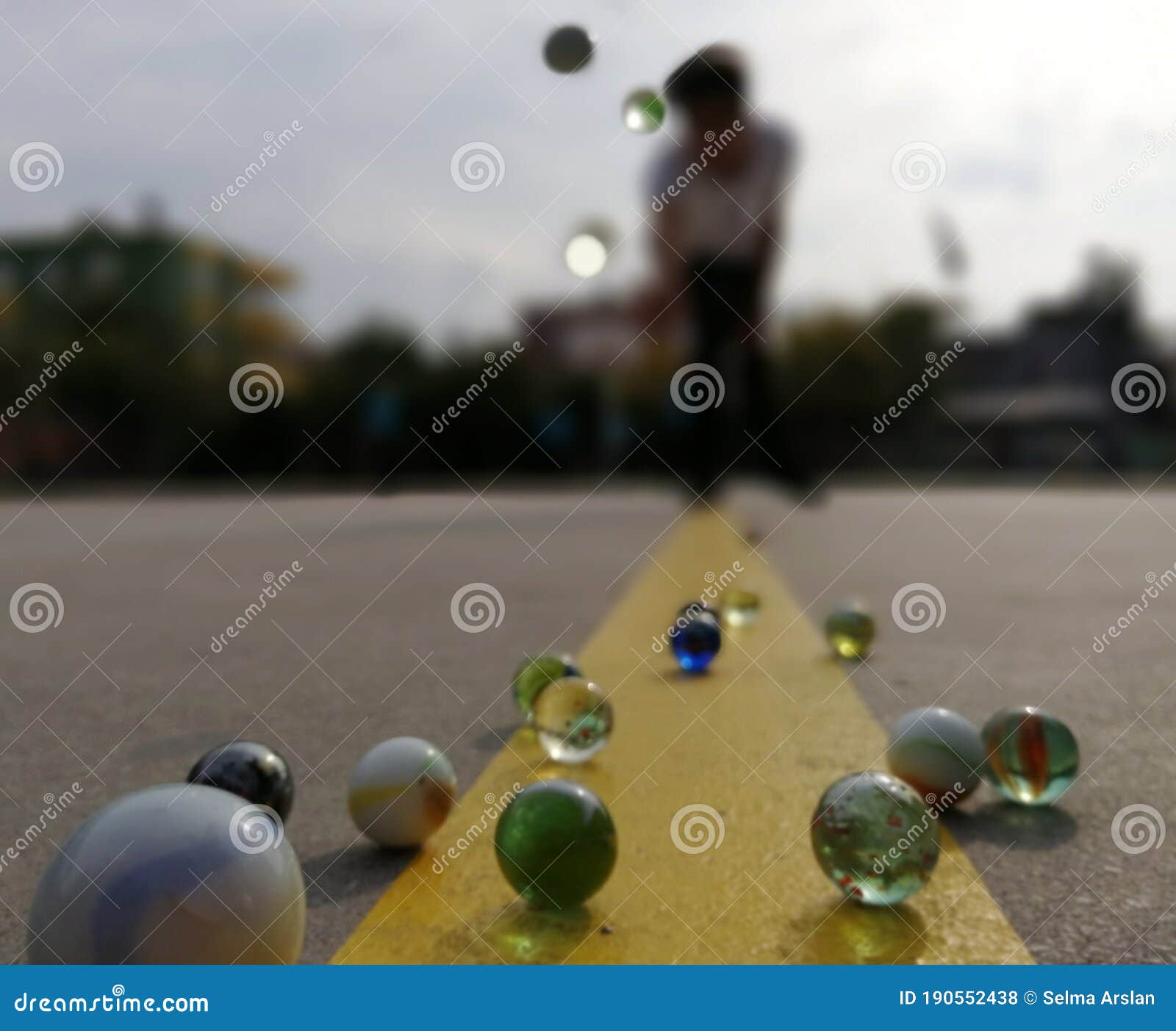 Marbles on the Sidewalk in the Light of the Setting Sun Stock Photo ...