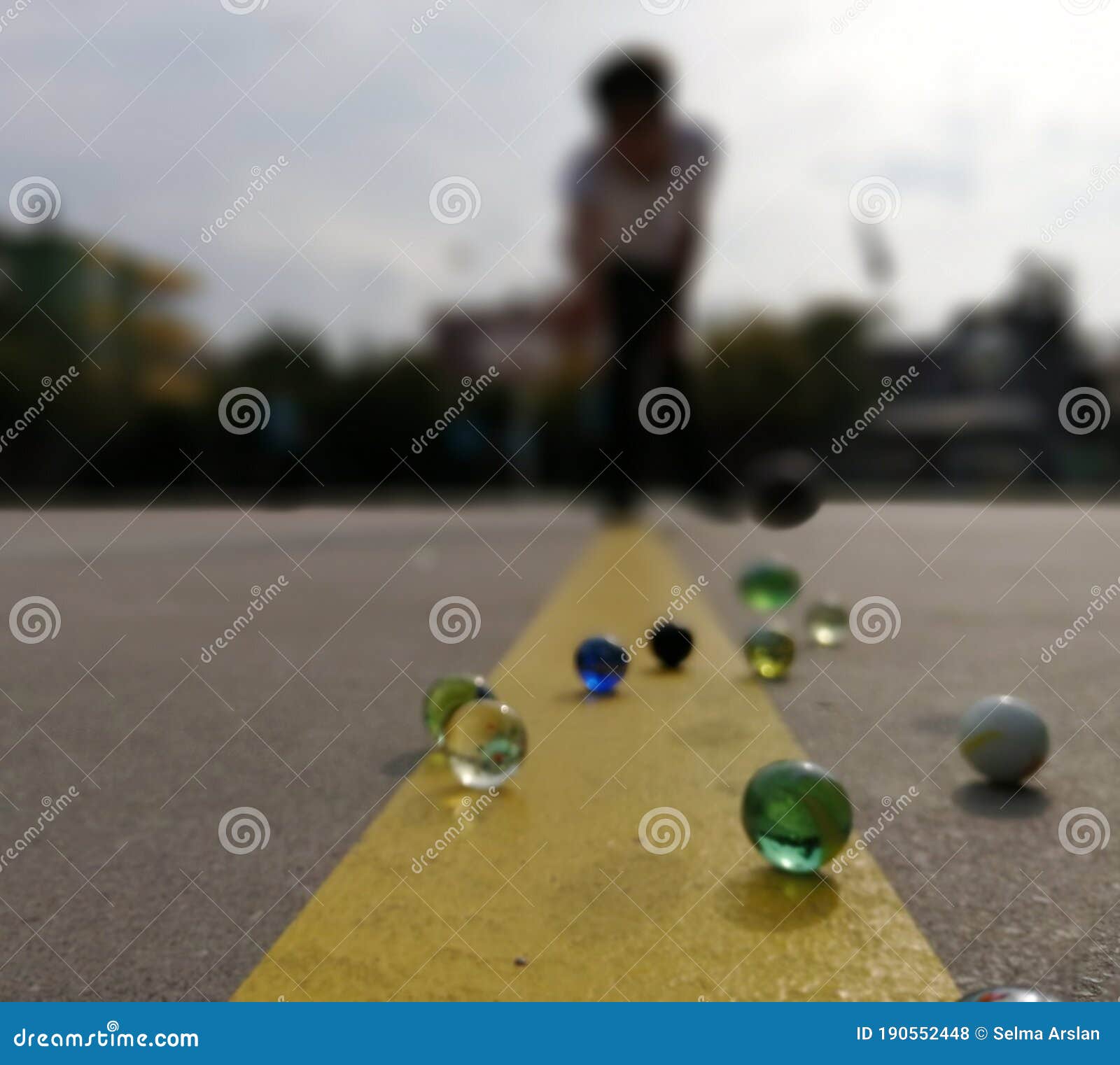 Marbles on the Sidewalk in the Light of the Setting Sun Stock Photo ...