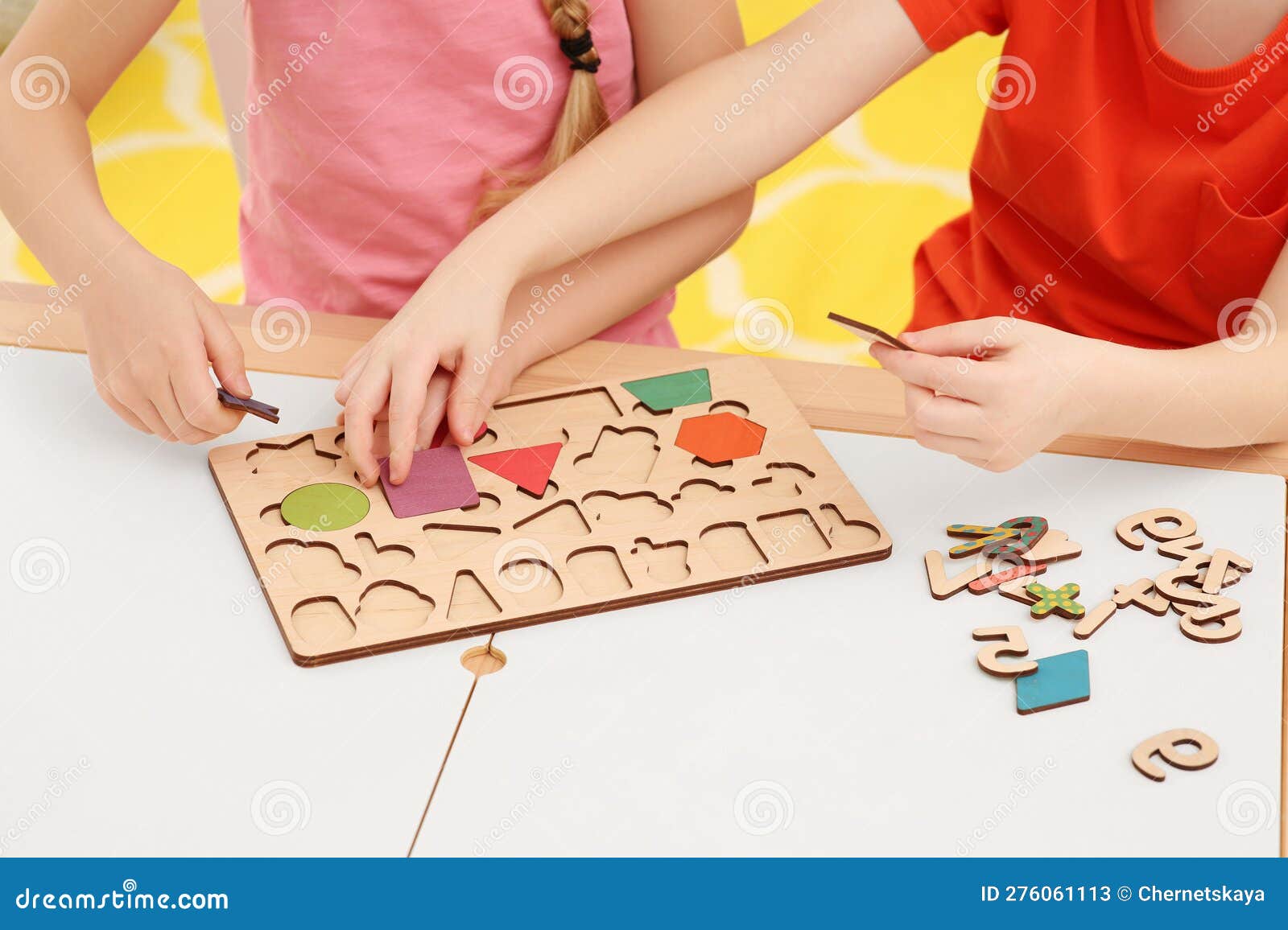 Children Playing with Math Game Kit at Desk Indoors, Closeup. Learning ...