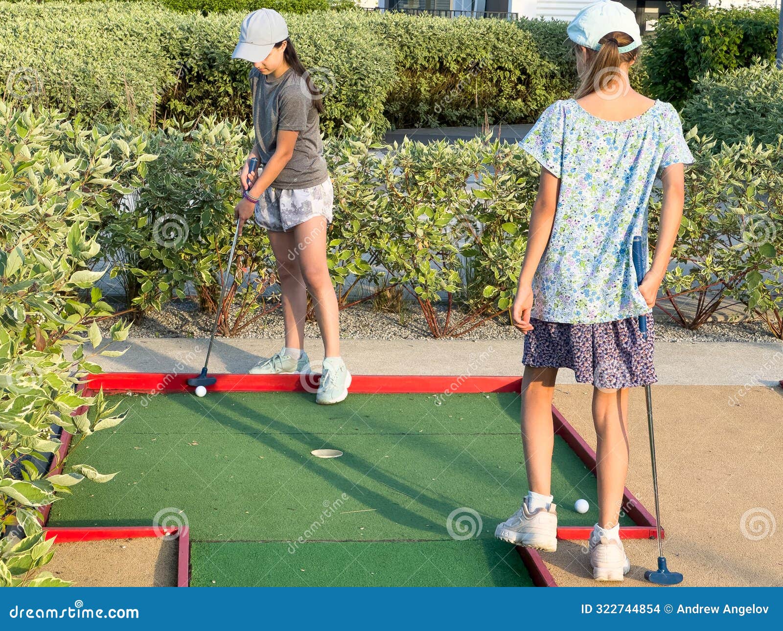 Children Playing Mini Golf. Child Golfer Stock Photo - Image of carpet ...