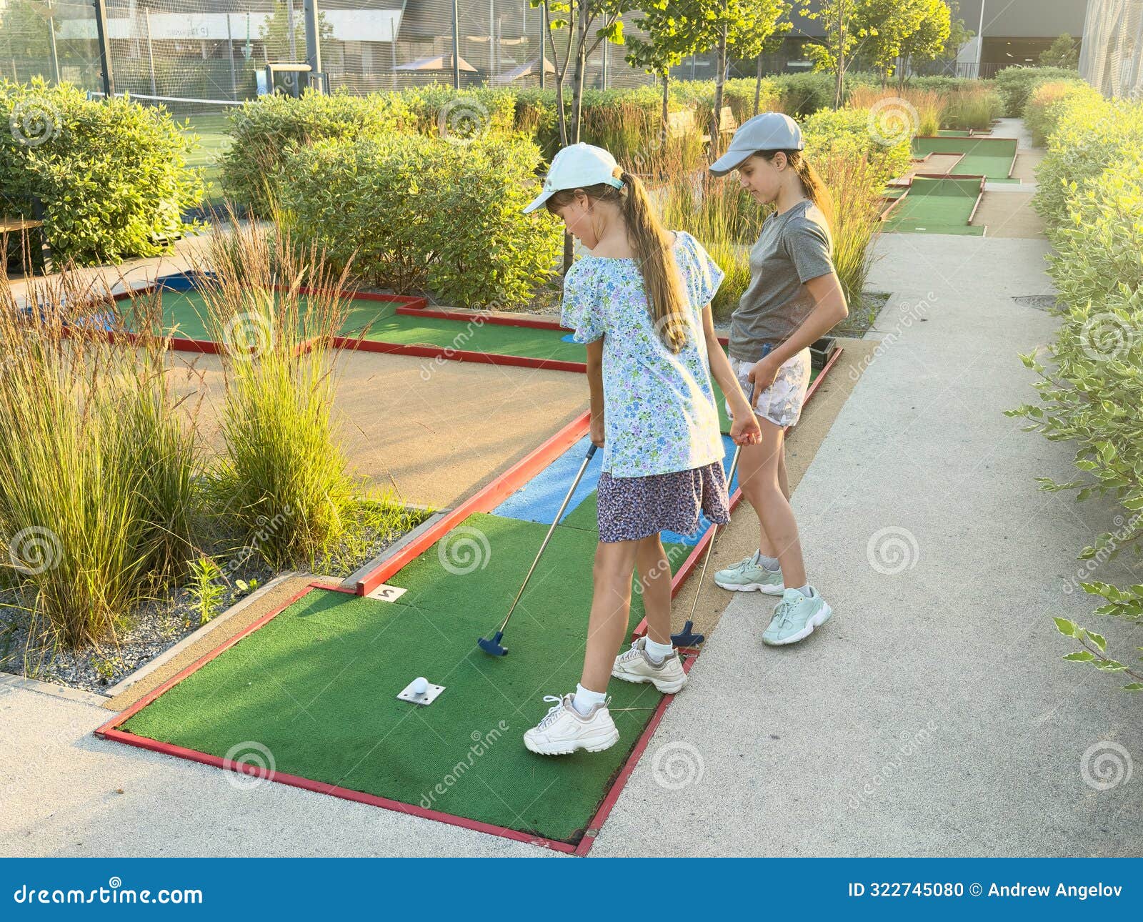 Children Playing Mini Golf. Child Golfer Stock Photo - Image of game ...