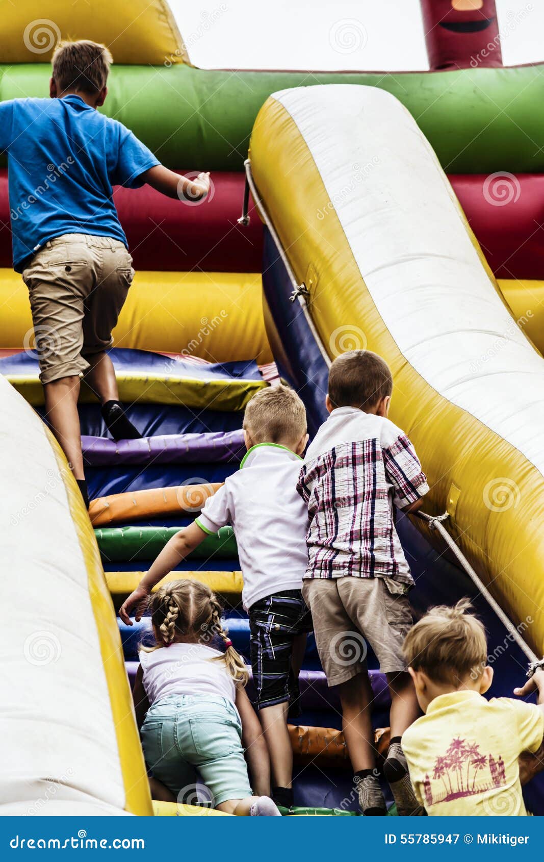 Children playing editorial photography. Image of inflatable - 55785947