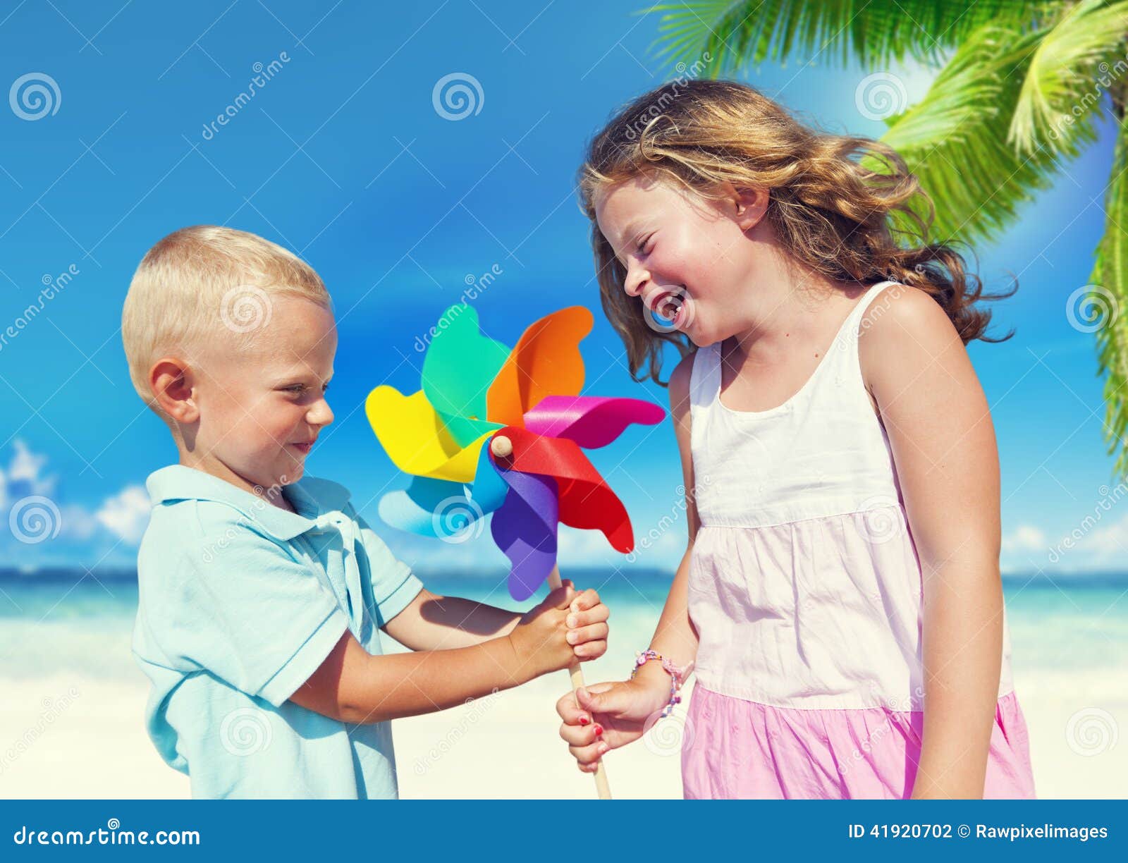 Children Playing With The Pinwheel On A Beach Royalty-Free Stock Image ...