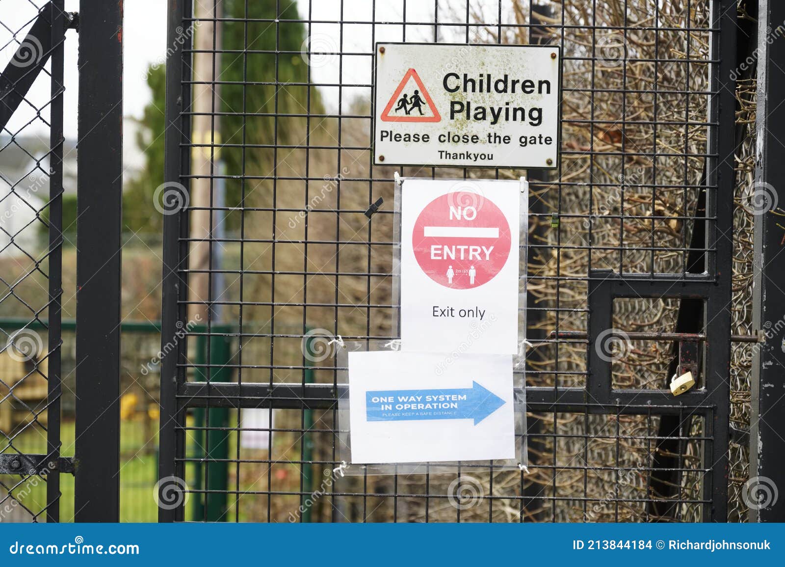 Children Playing Please Close Gate Sign at Playground Stock Photo ...