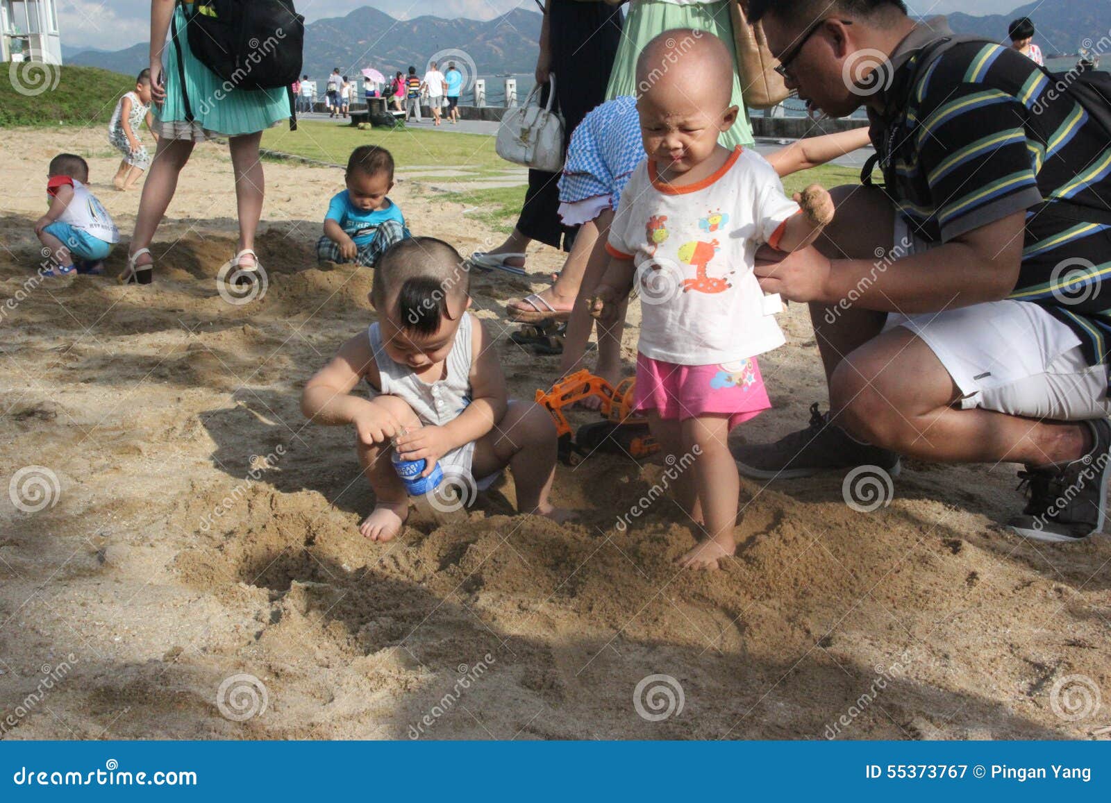 Children playing with sand editorial photography. Image of football ...