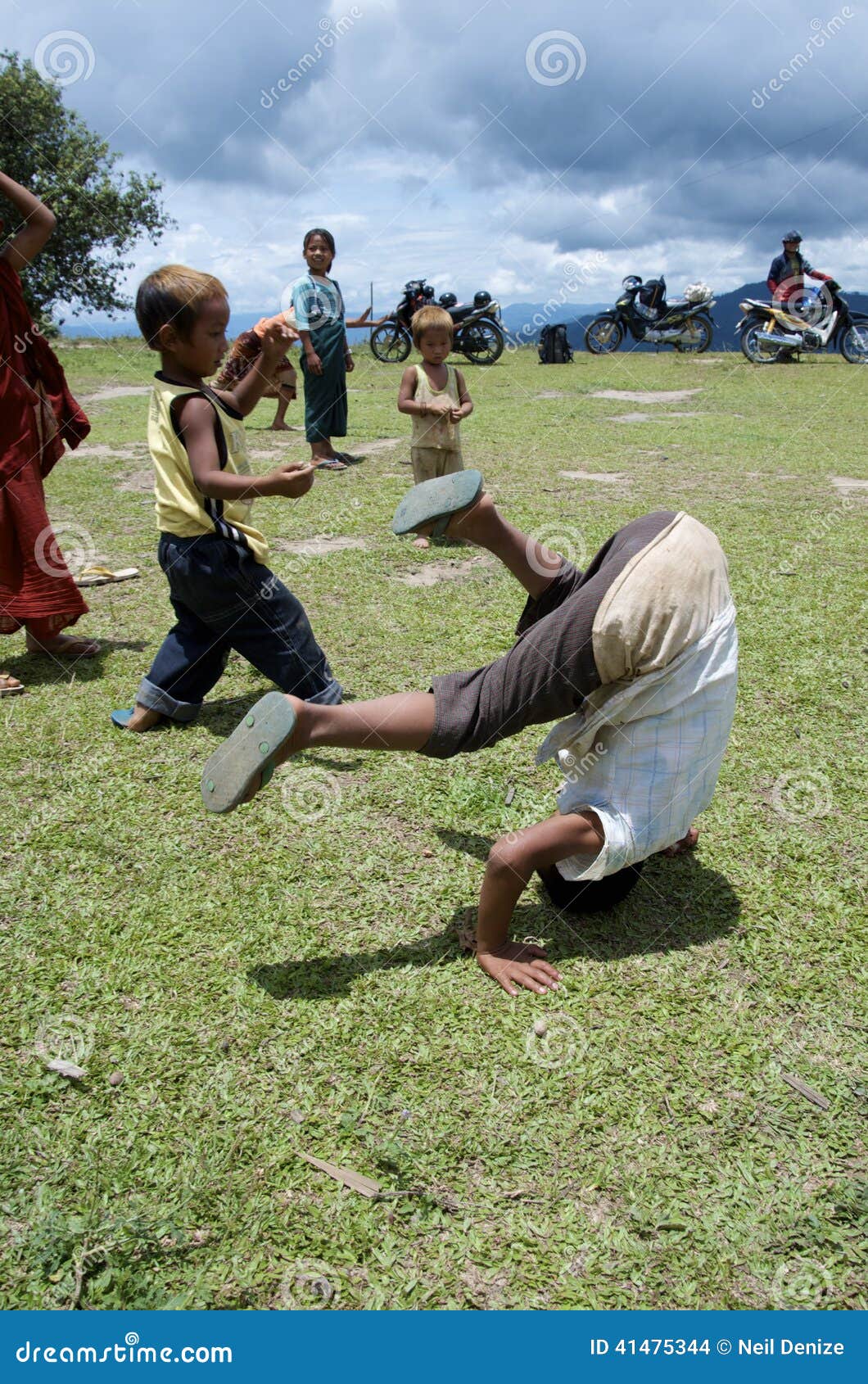 Children Playing on the School Field Working on the Headstands ...