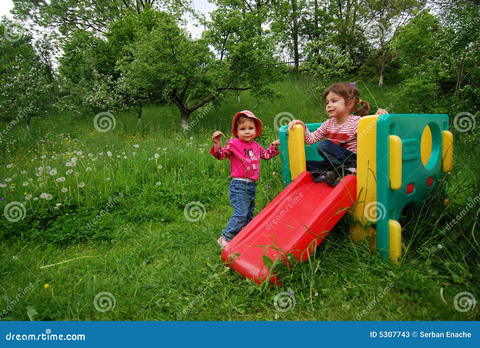 Children playing on slide stock image. Image of happy - 5307743