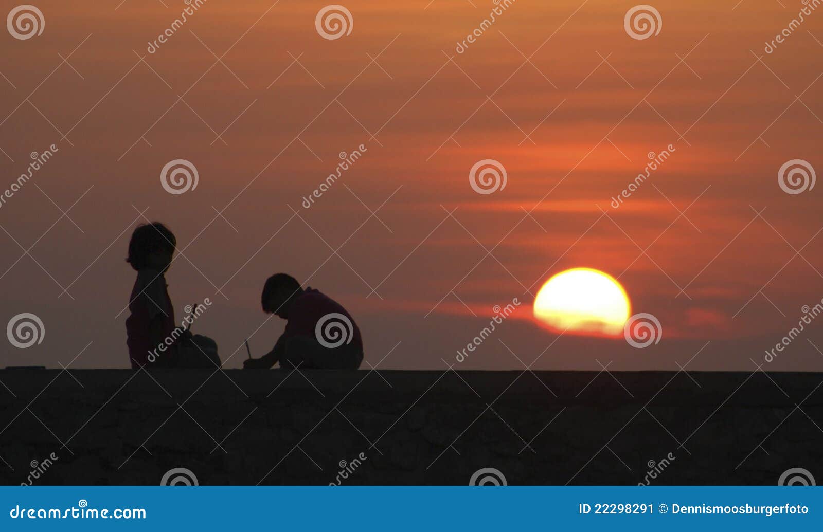 Children Playing at Sunset stock image. Image of dark - 22298291