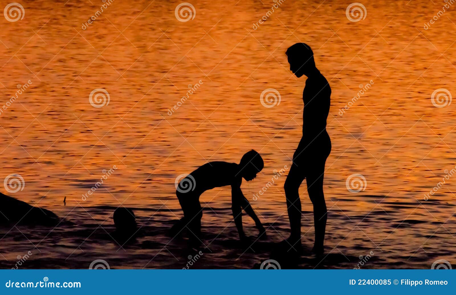 Children Playing in the Sunset Stock Image - Image of dark, river: 22400085