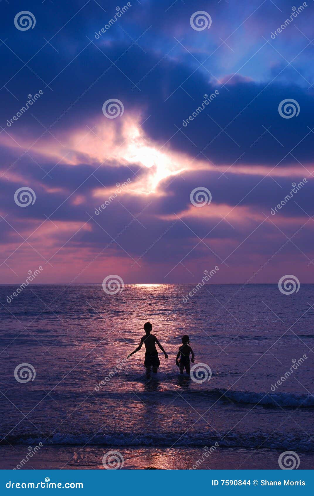 Children Playing at Sunset on the Beach Stock Photo - Image of purple ...