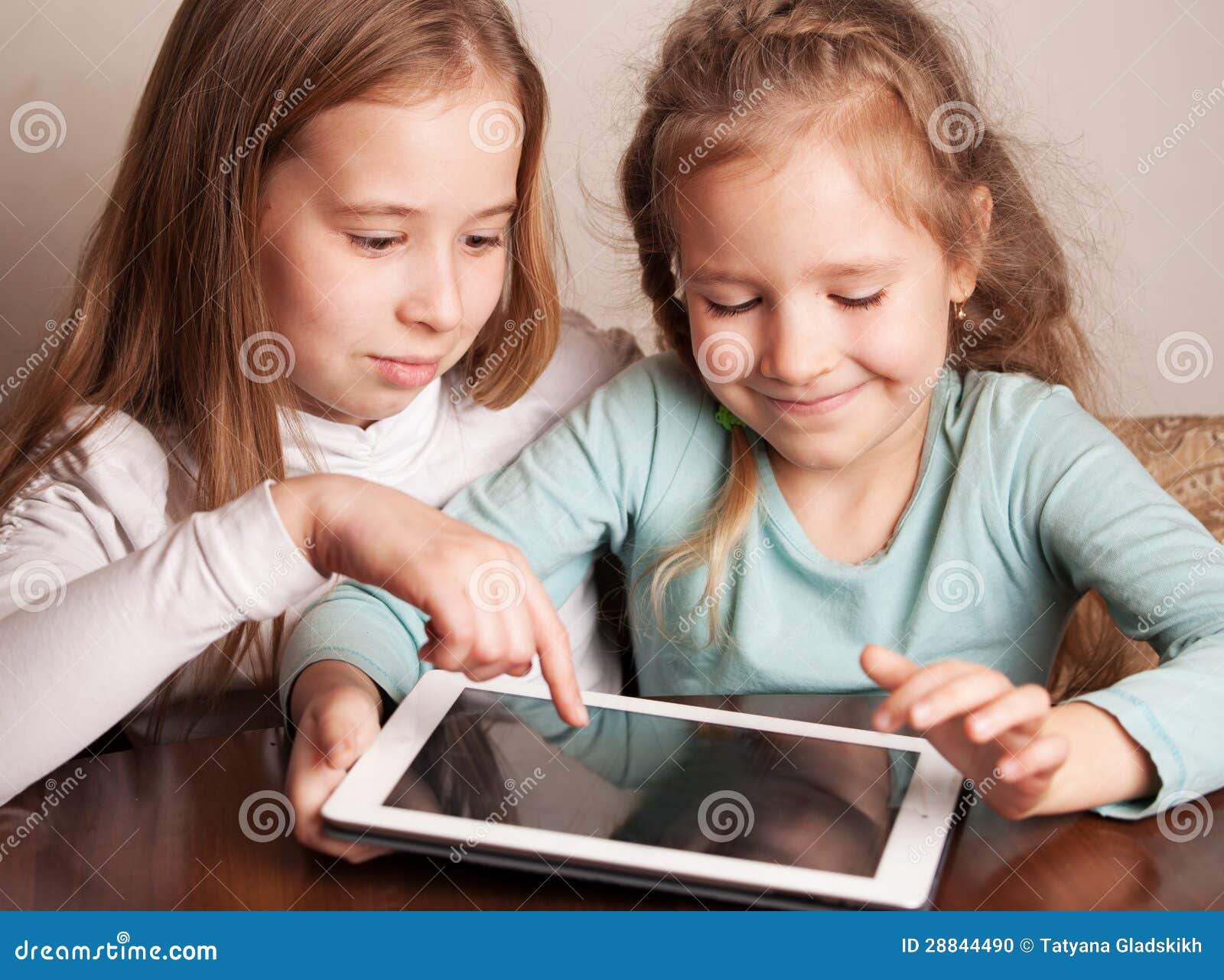 Children playing on tablet stock photo. Image of little - 28844490