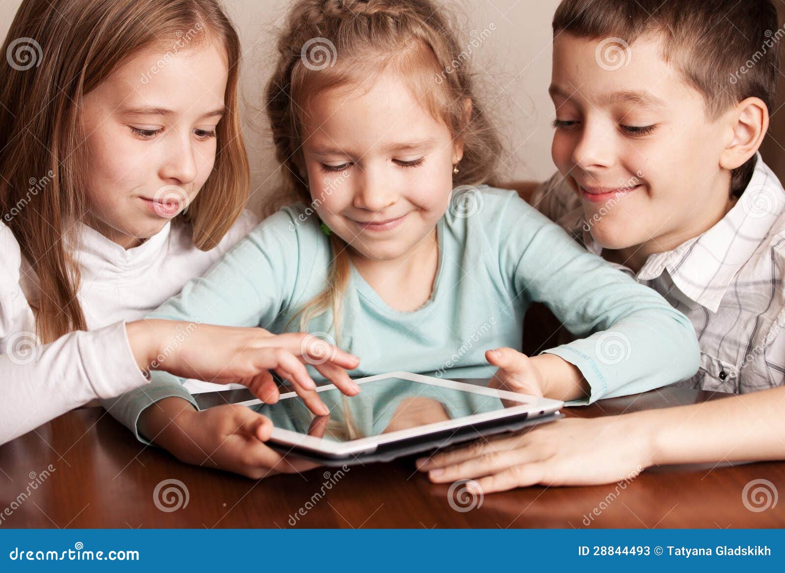 Children playing on tablet stock image. Image of learning - 28844493