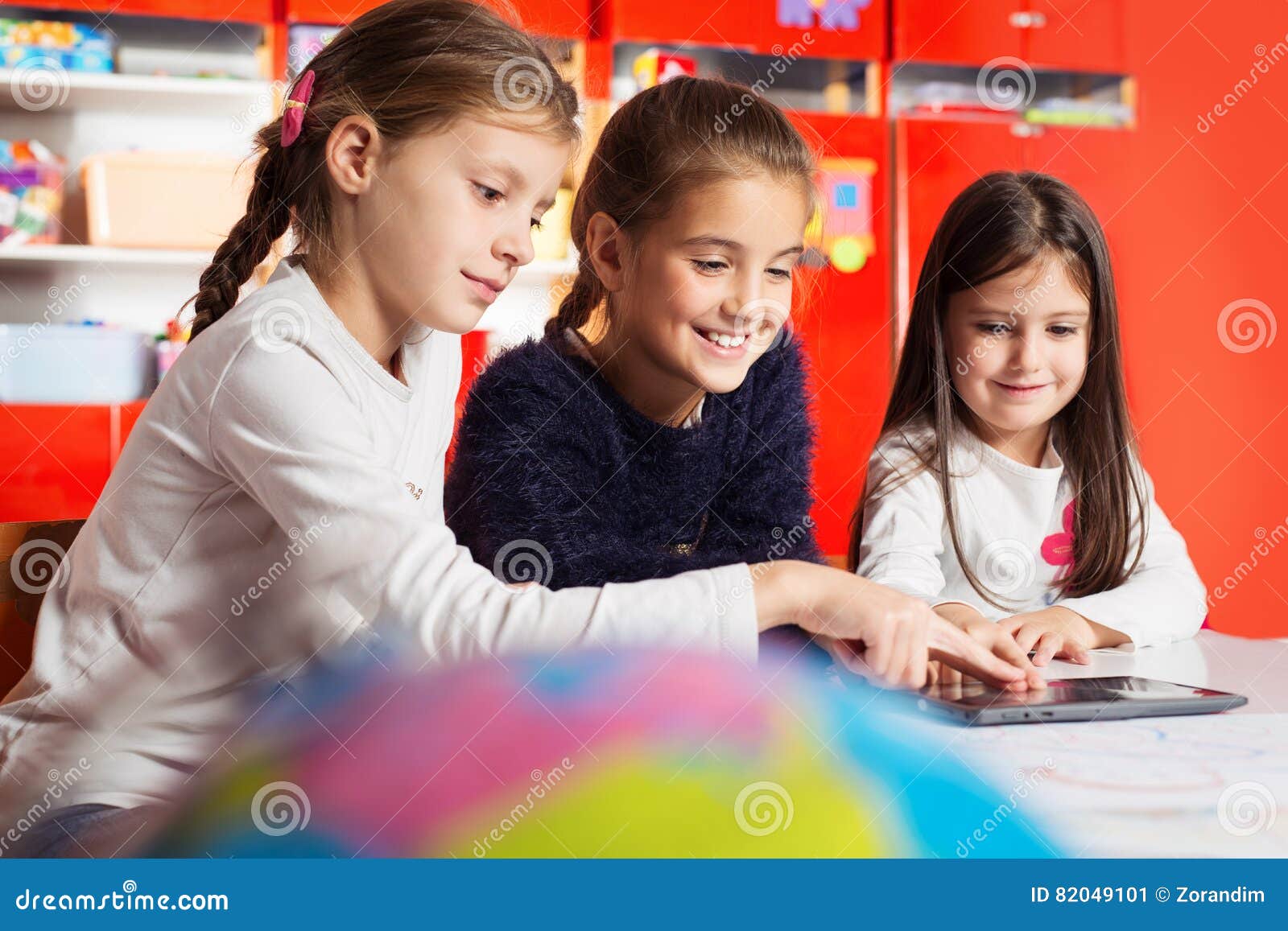 Children playing on tablet stock image. Image of learning - 82049101