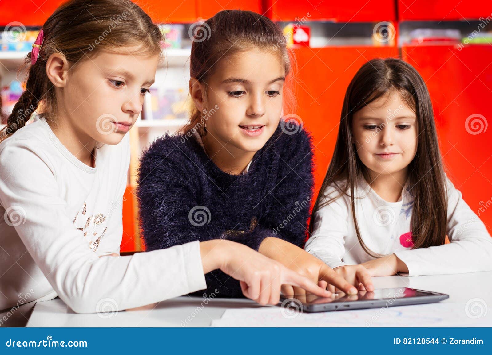 Children playing on tablet stock photo. Image of person - 82128544
