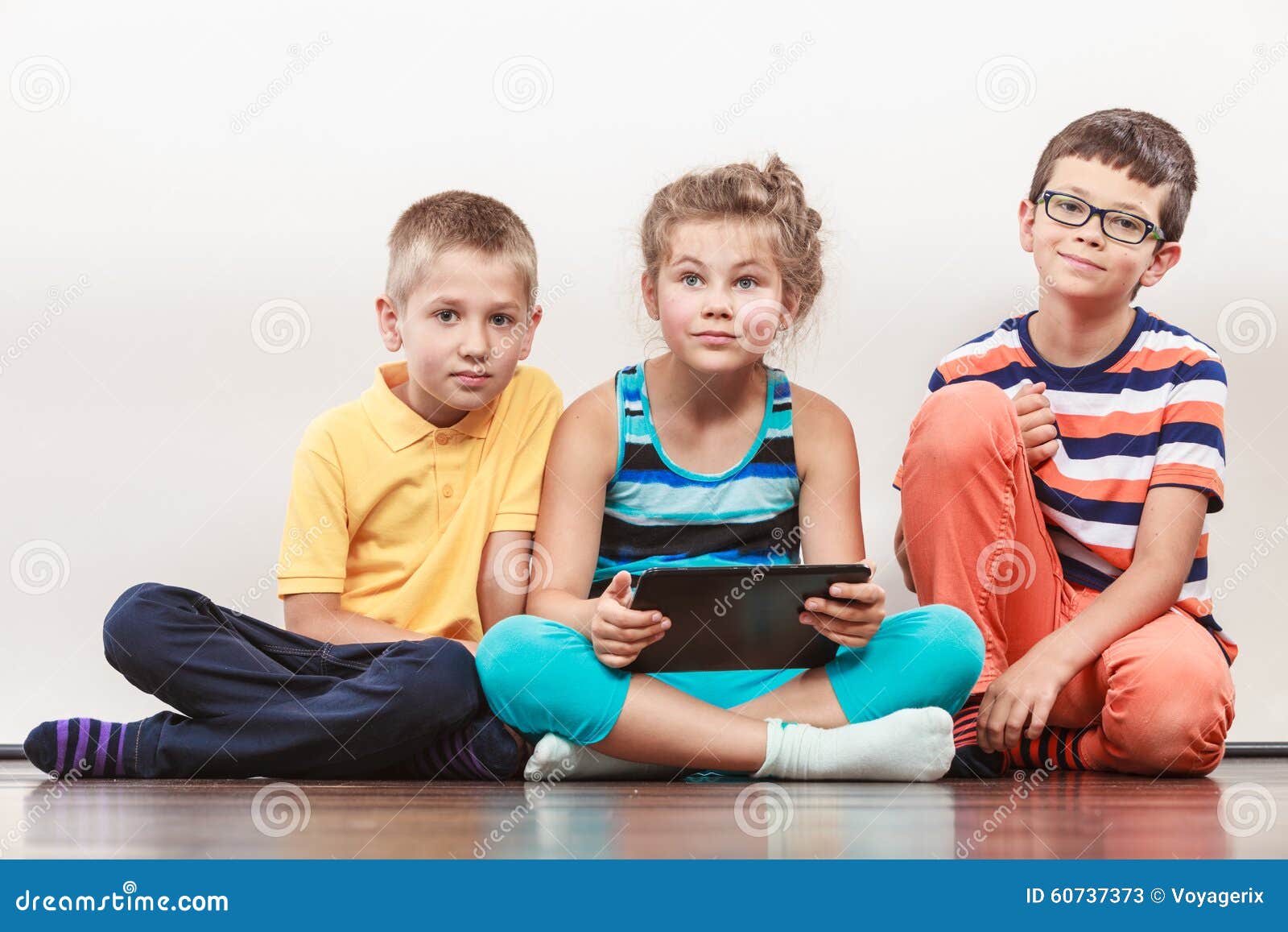 Children Playing on Tablet. Stock Image - Image of child, surf: 60737373